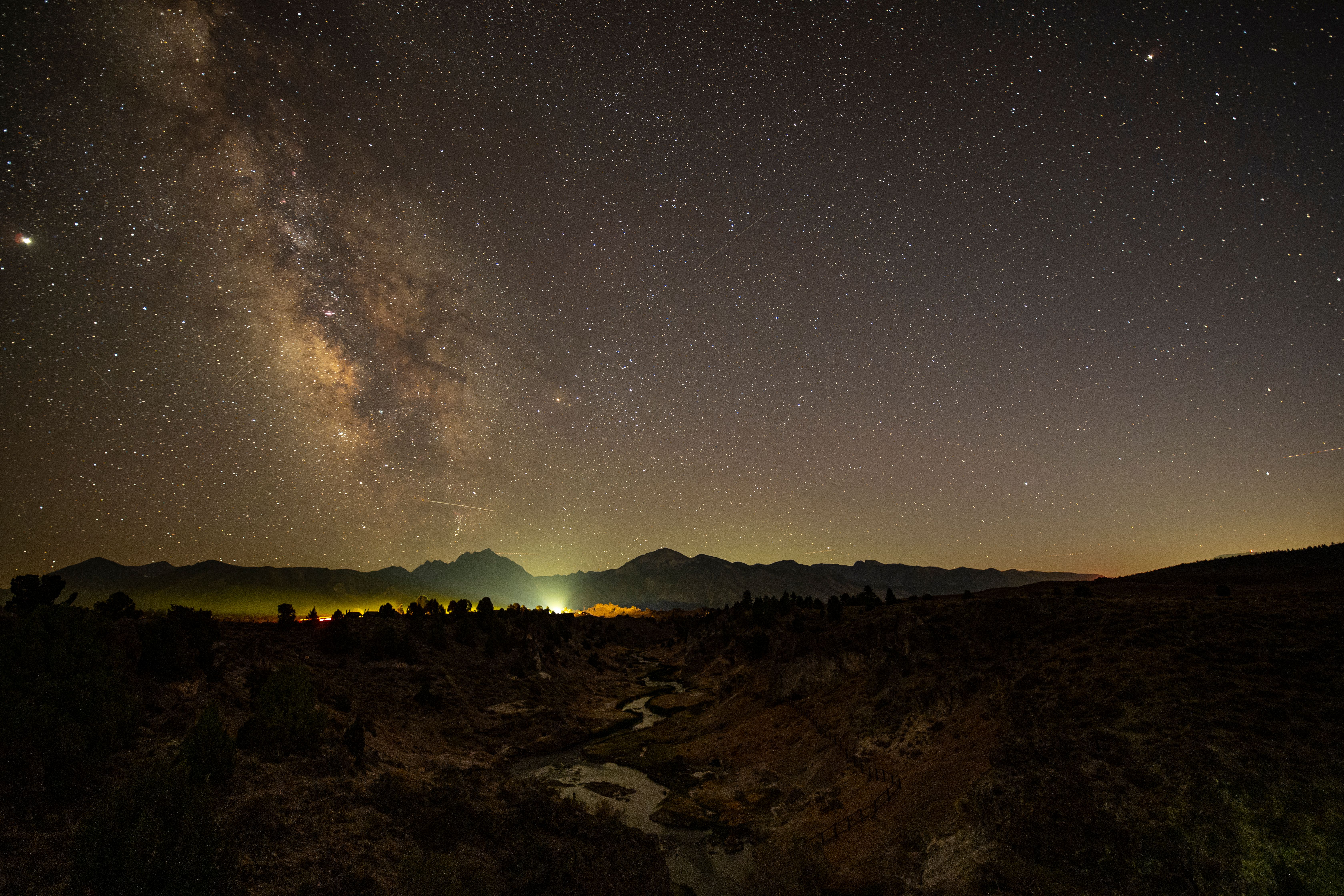 Starry Night Sky Over Remote Mountain Landscape · Free Stock Photo