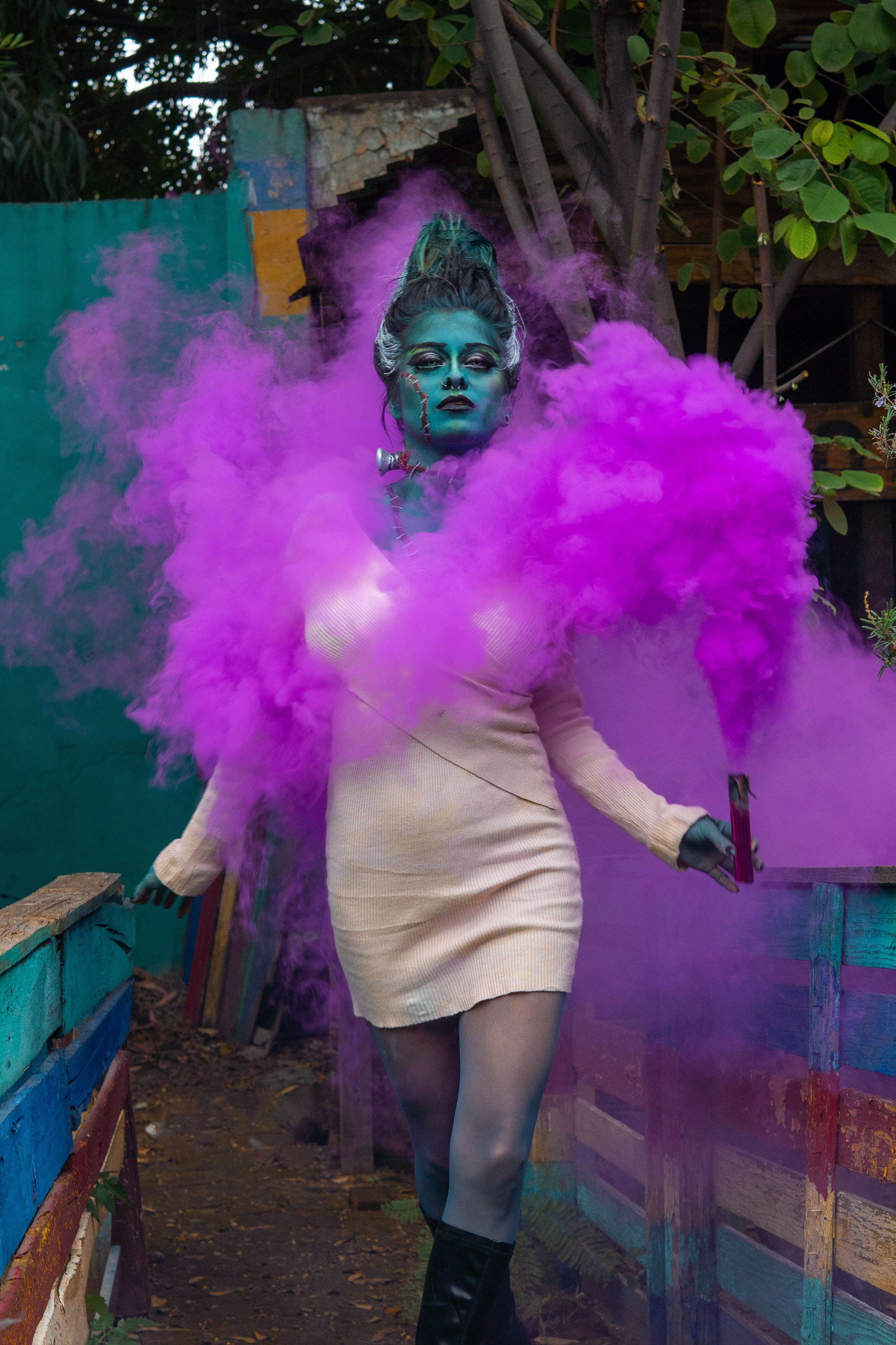 Vibrant Female Cosplay with Colorful Smoke · Free Stock Photo