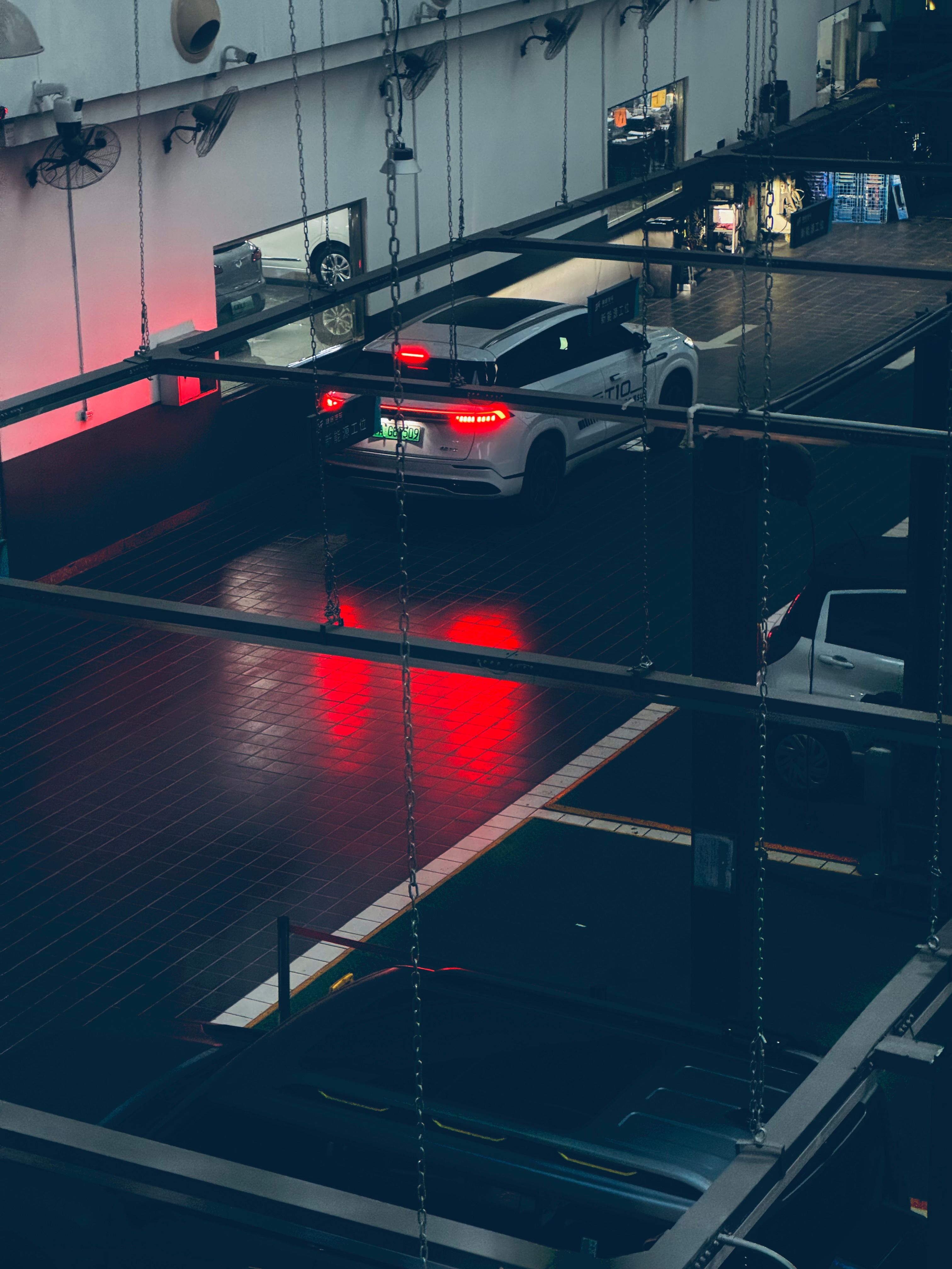 Modern Car in Dimly Lit Indoor Parking Garage · Free Stock Photo