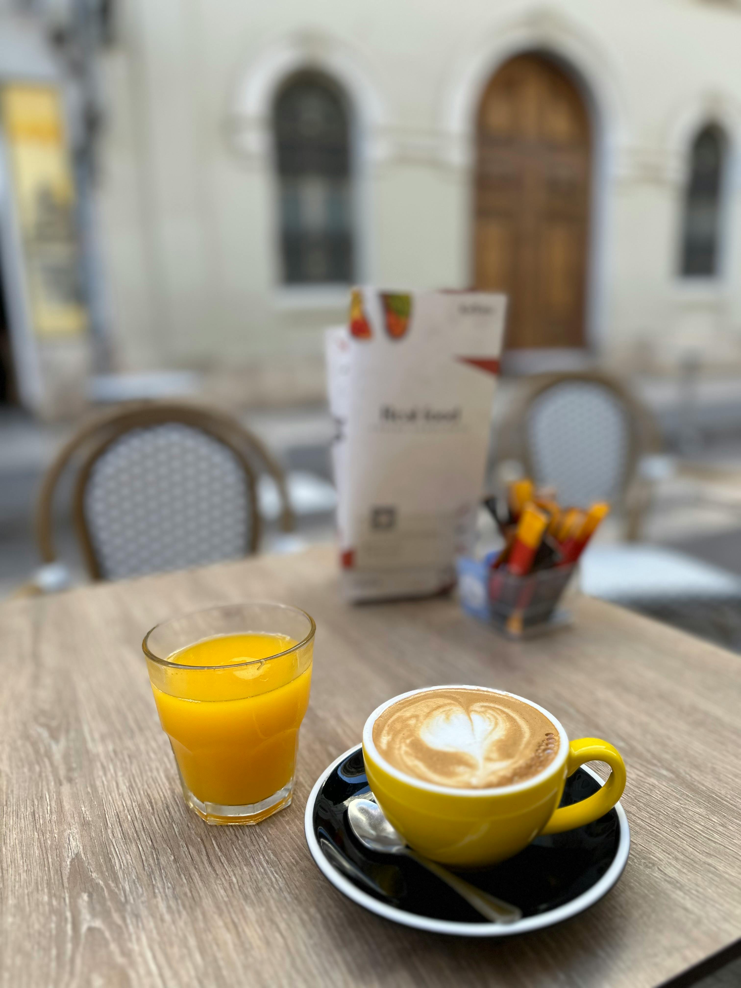 Relaxing Outdoor Cafe Setting with Drinks · Free Stock Photo