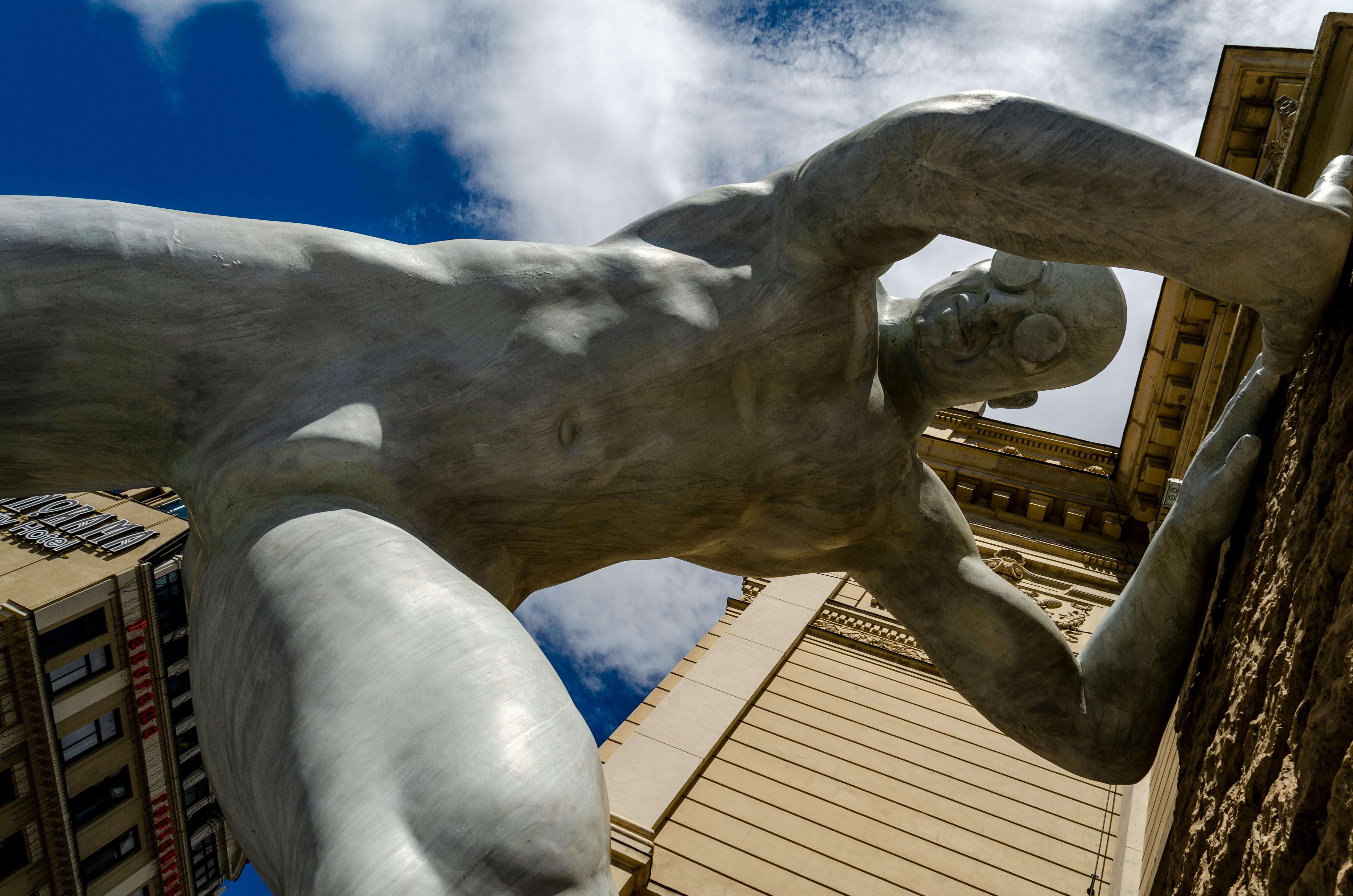 Dramatic Sculpture Against Blue Sky in Lviv · Free Stock Photo