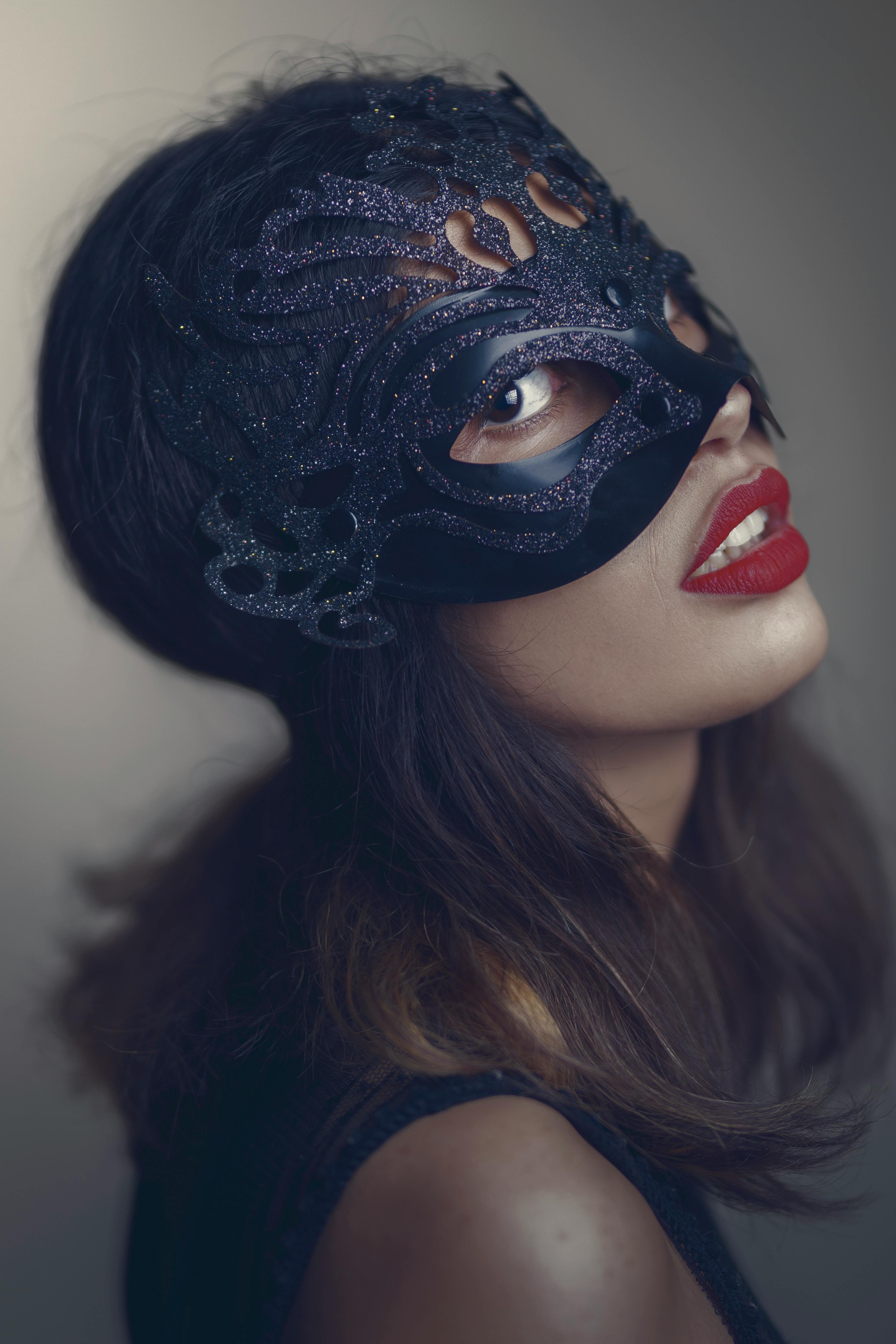 Elegant Woman in Ornate Black Masquerade Mask · Free Stock Photo