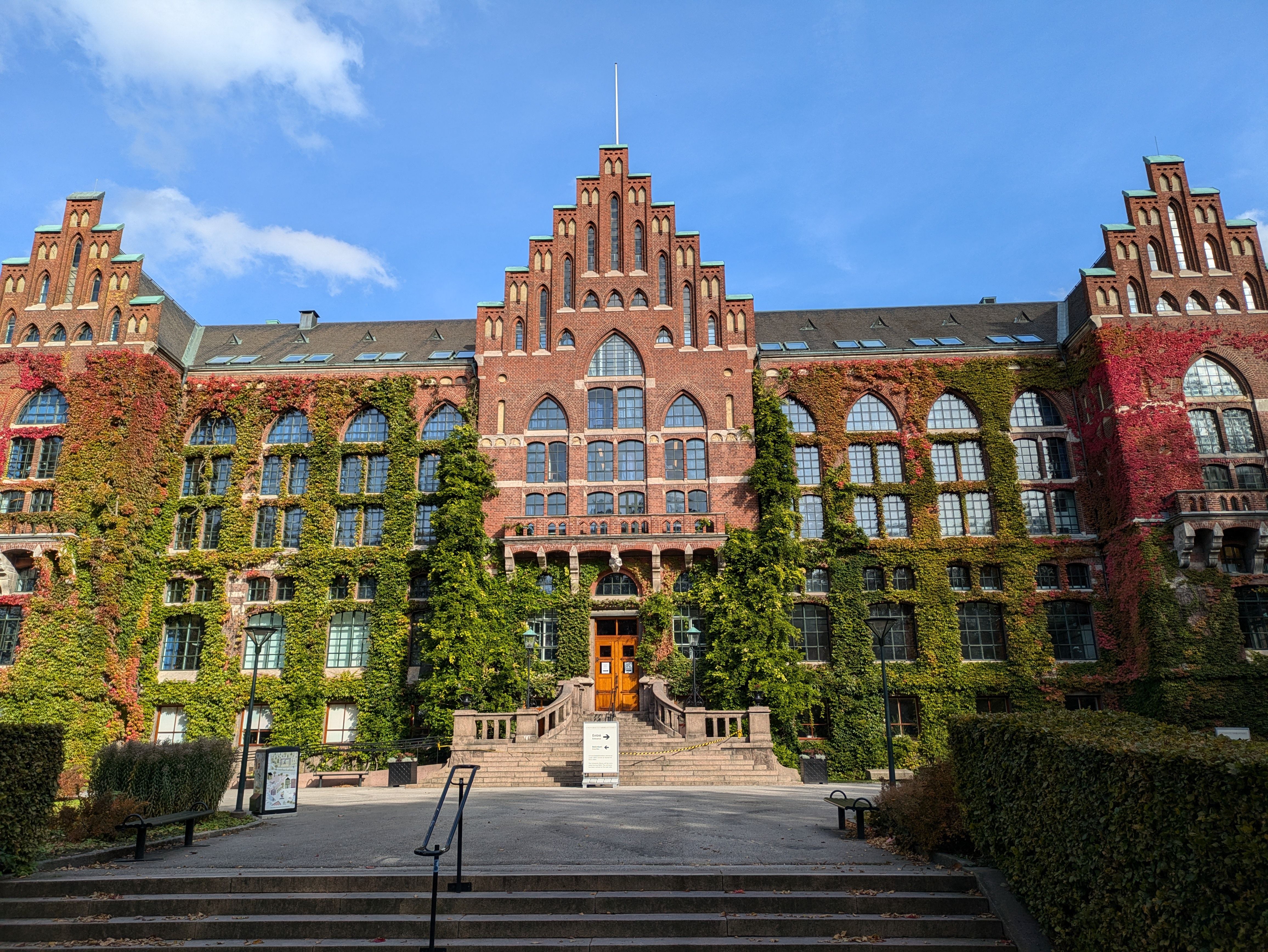 Historic Building with Gothic Architecture and Ivy · Free Stock Photo