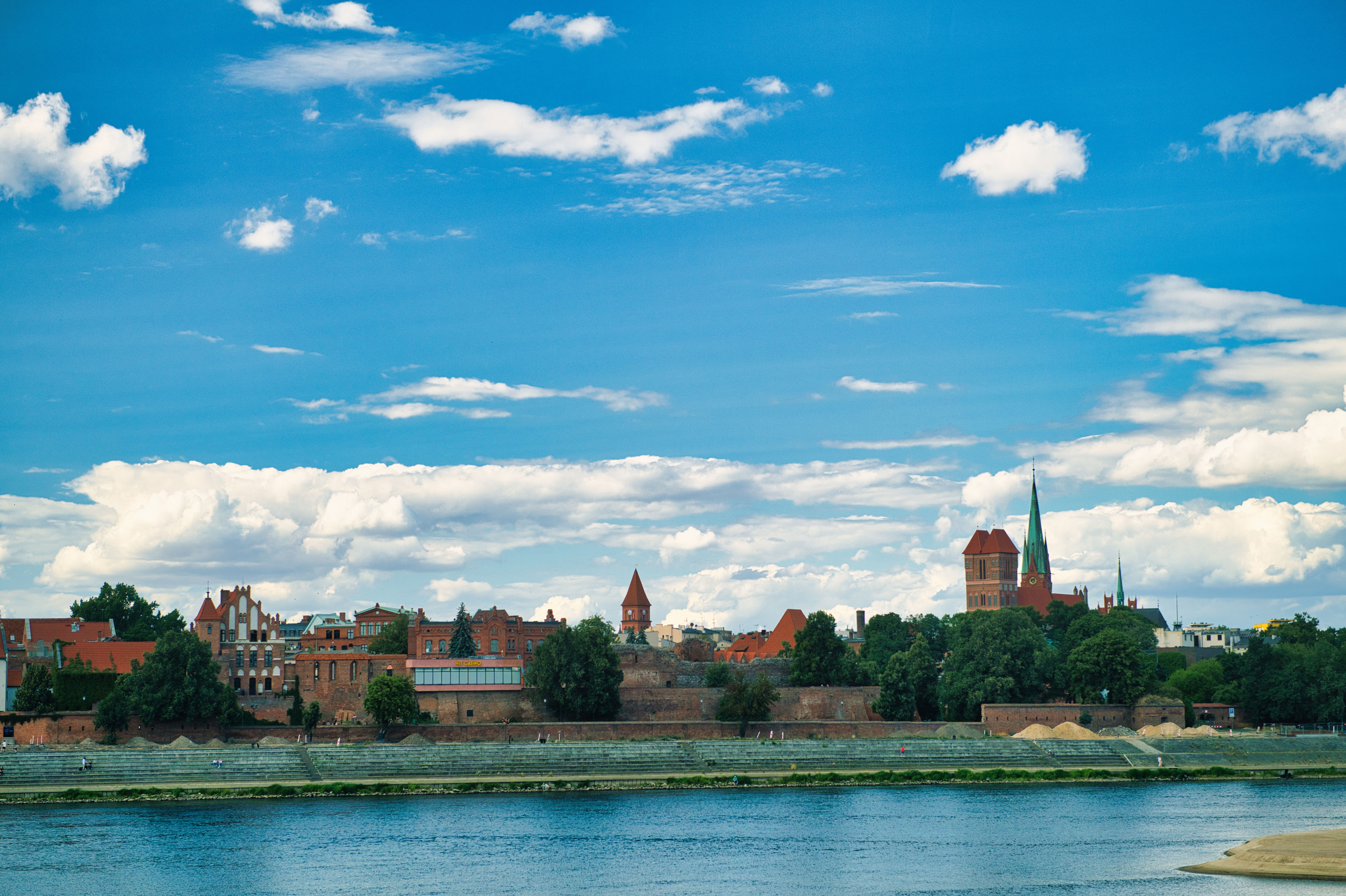 Scenic View of Toruń Old Town by the River · Free Stock Photo