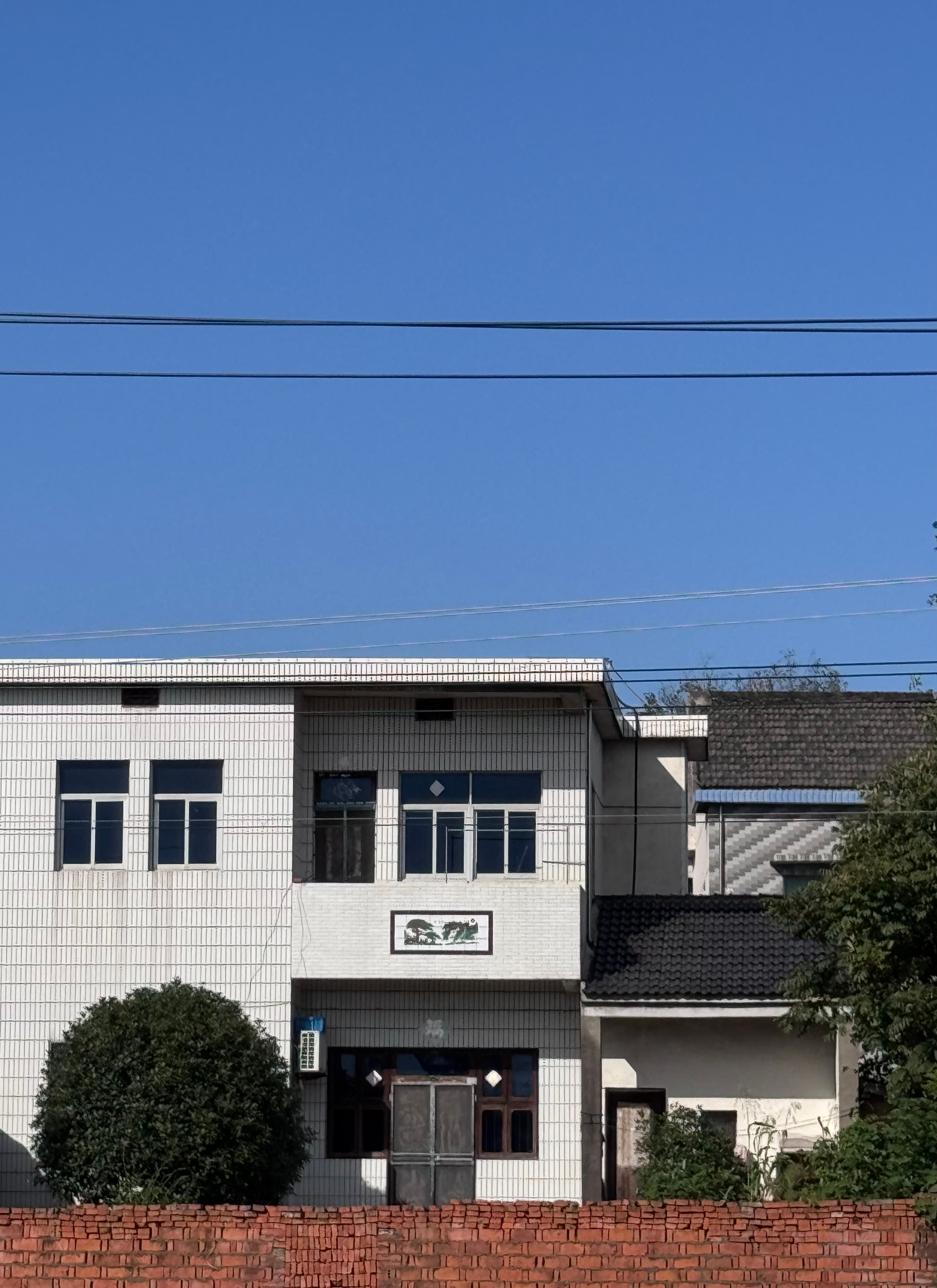 Urban Two-Story Building Under Clear Sky · Free Stock Photo