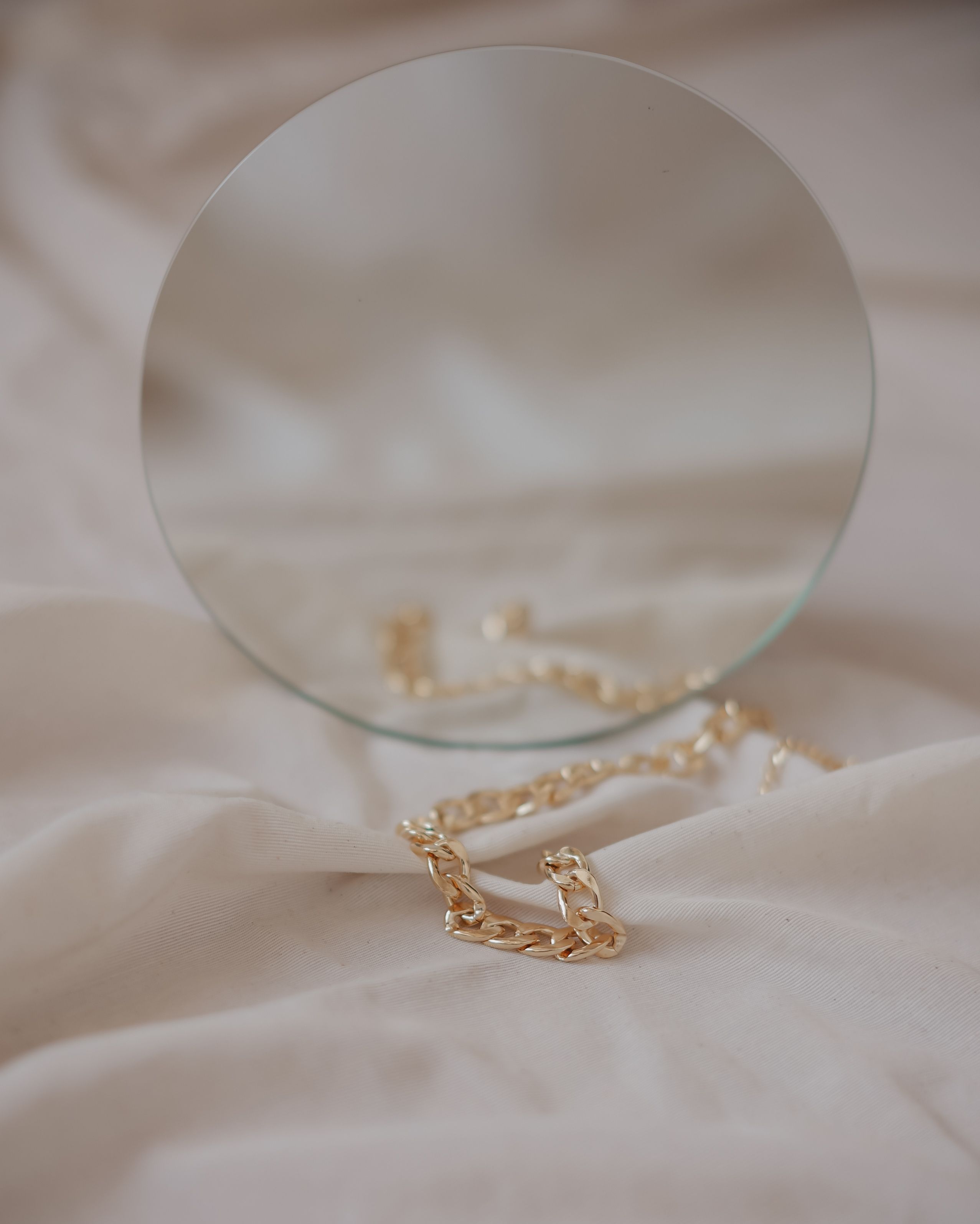 Elegant Gold Chain Reflected in Mirror · Free Stock Photo