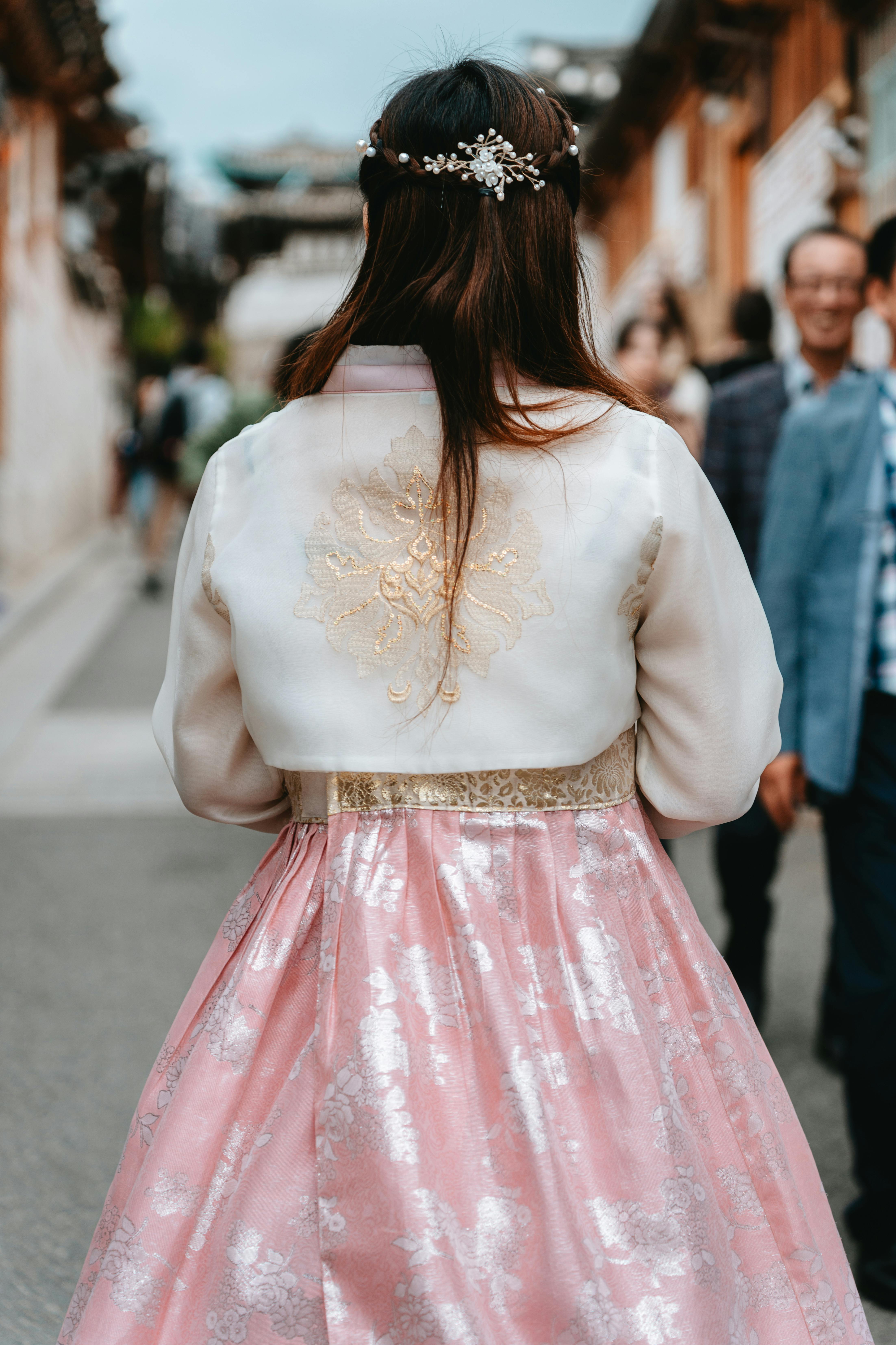 Woman in Traditional Hanbok Walking in Seoul · Free Stock Photo