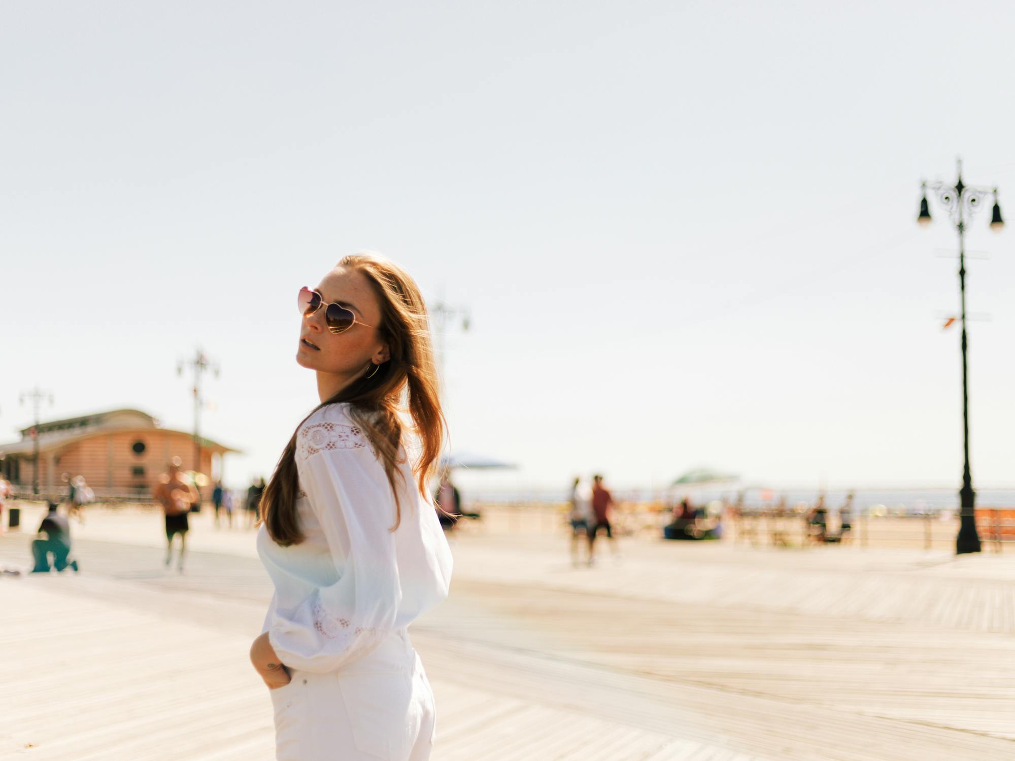 Selective Focus Photography Of Woman Wearing White Long Sleeved Top