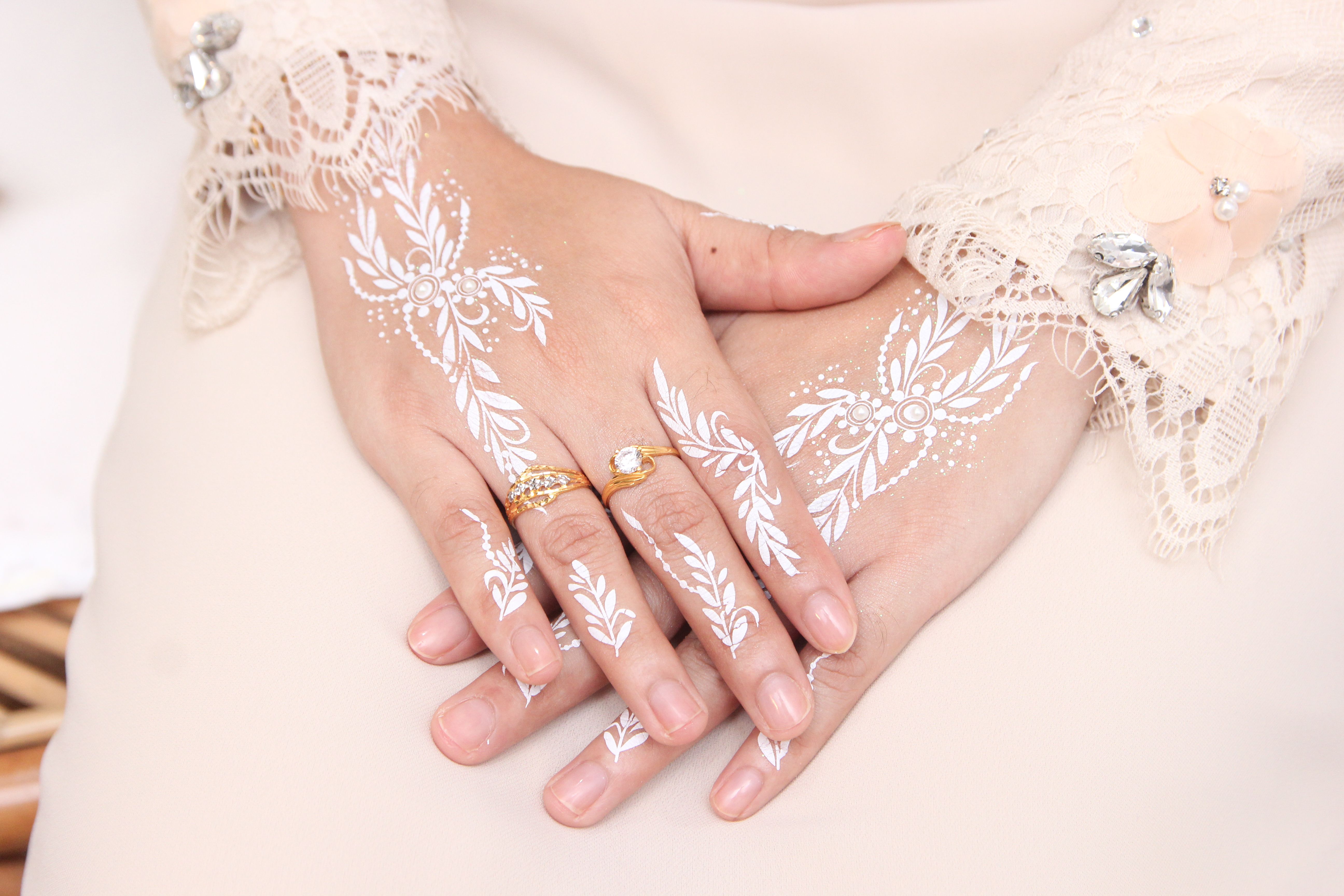 Elegant White Henna Hand Art on Bride · Free Stock Photo