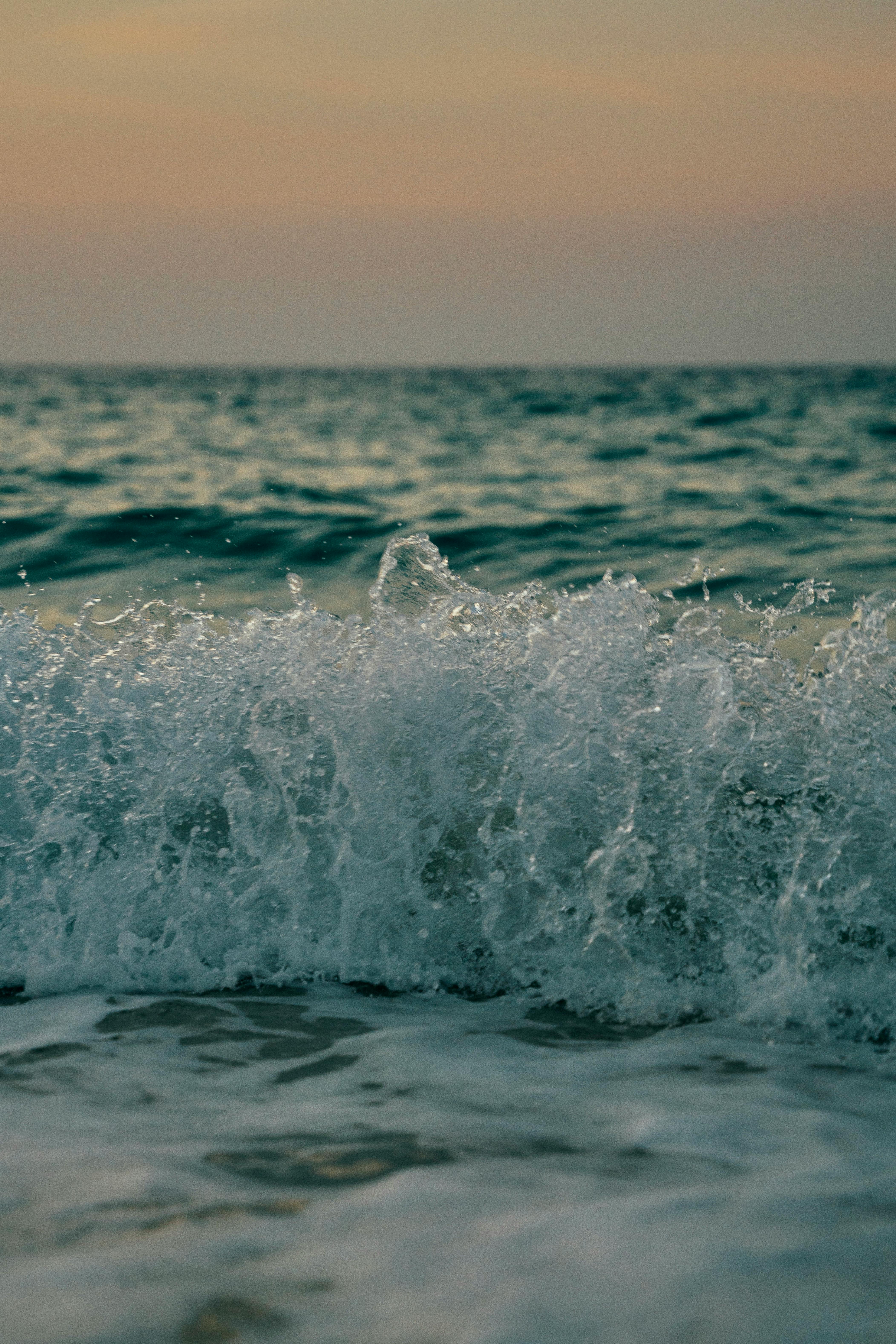 Ocean Waves Crashing at Sunrise in Muscat · Free Stock Photo