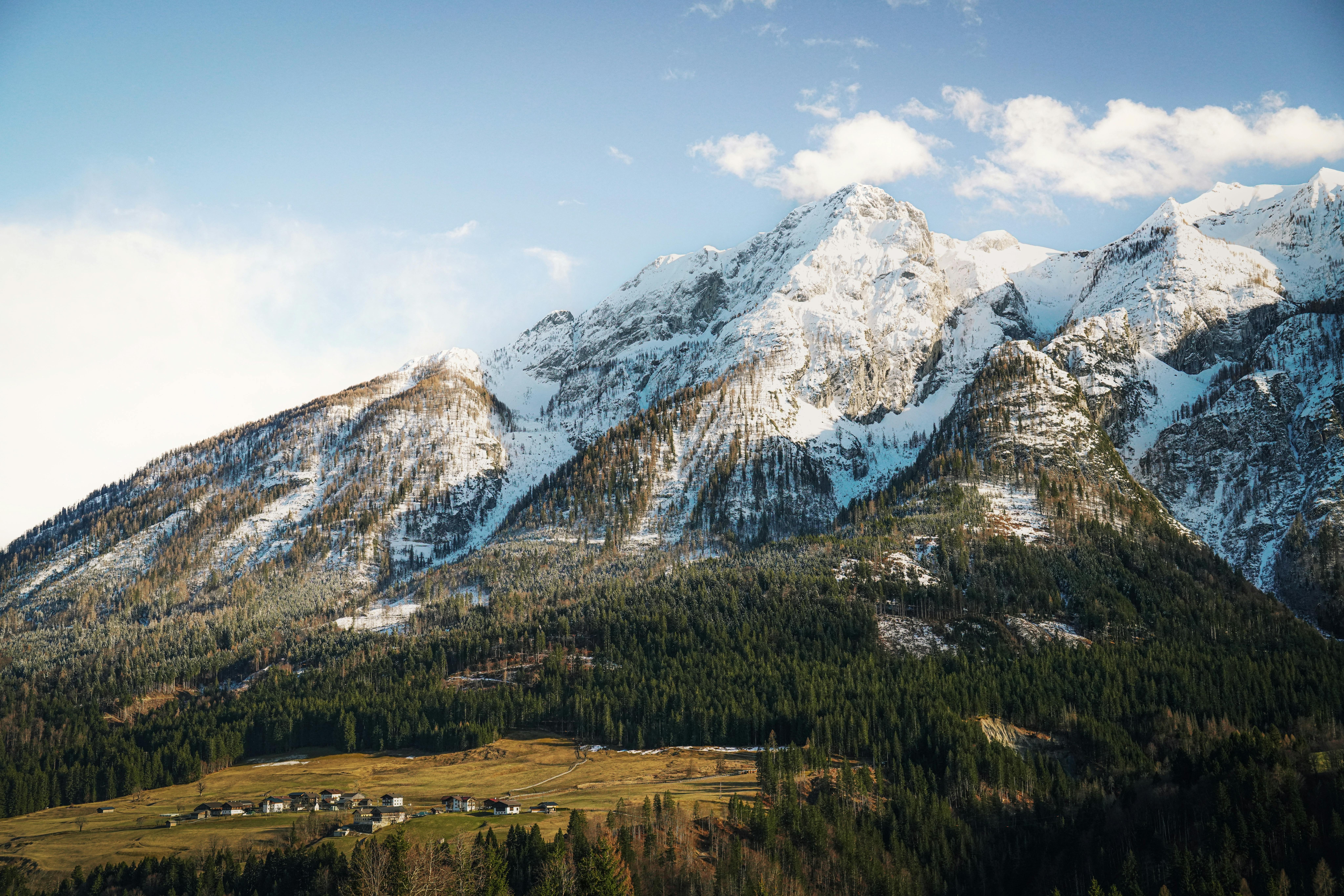 Snow-Capped Mountains in Serene Alpine Setting · Free Stock Photo