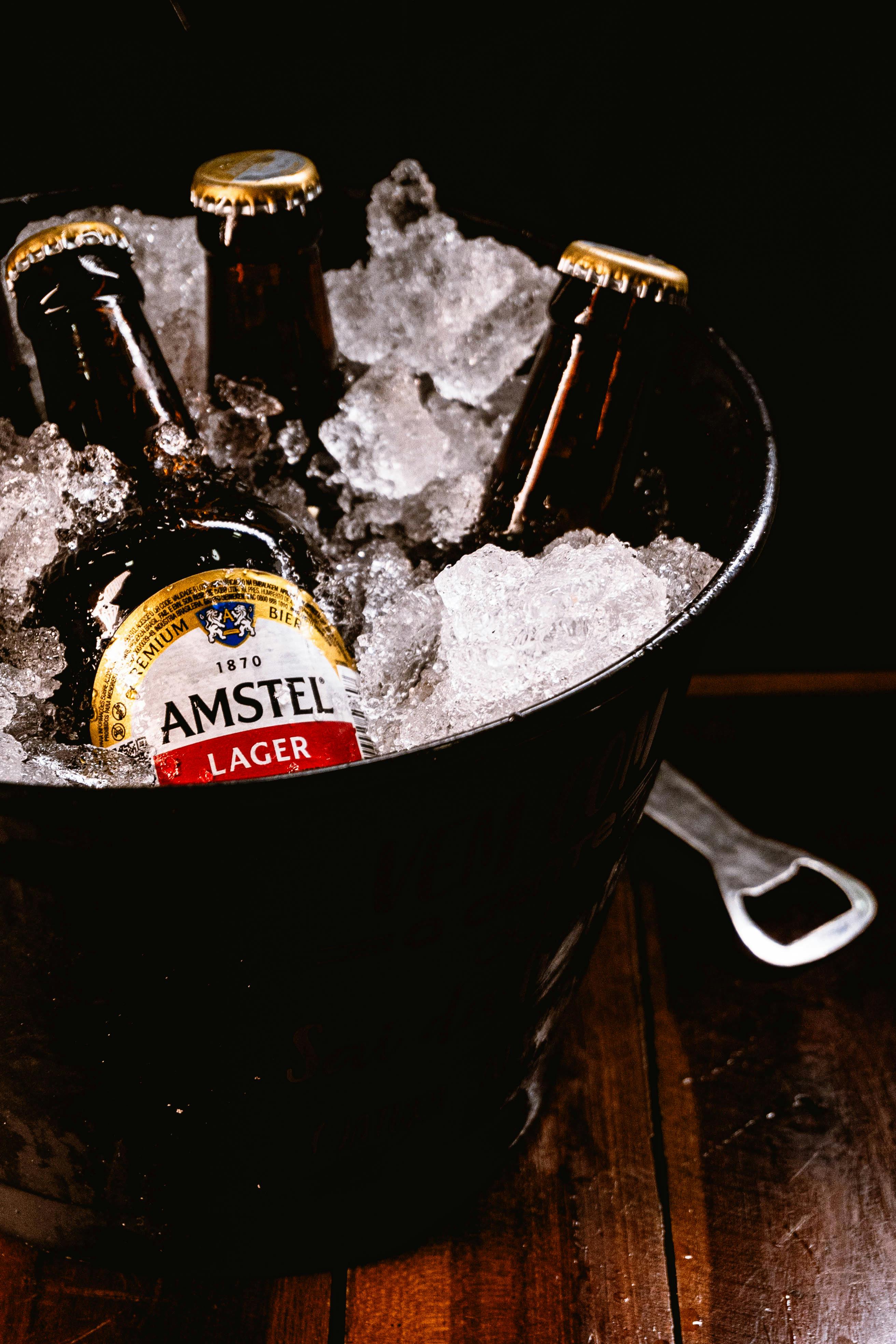 Chilled Amstel Lager Bottles in Ice Bucket · Free Stock Photo