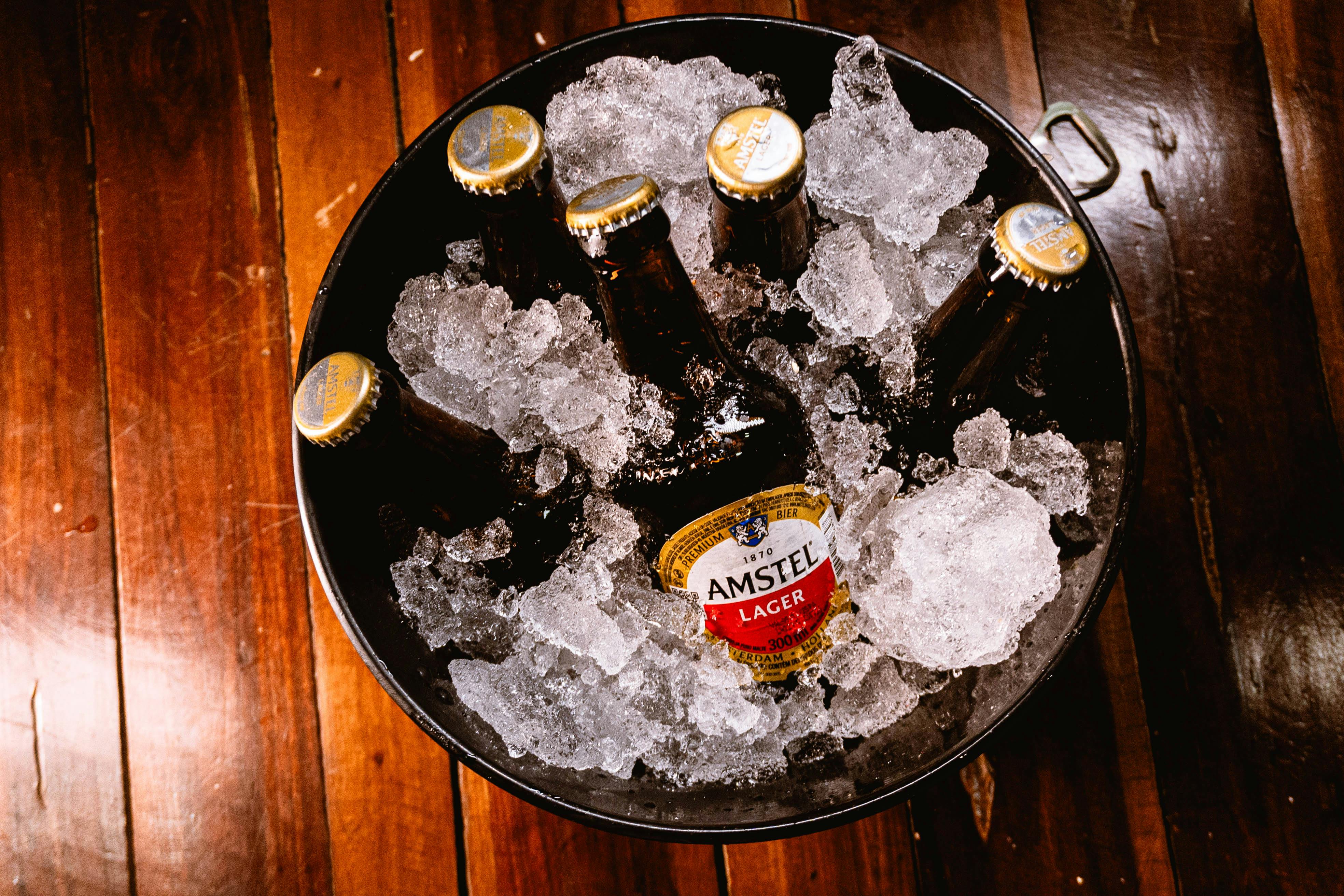 Chilled Amstel Lager Bottles in Ice Bucket · Free Stock Photo