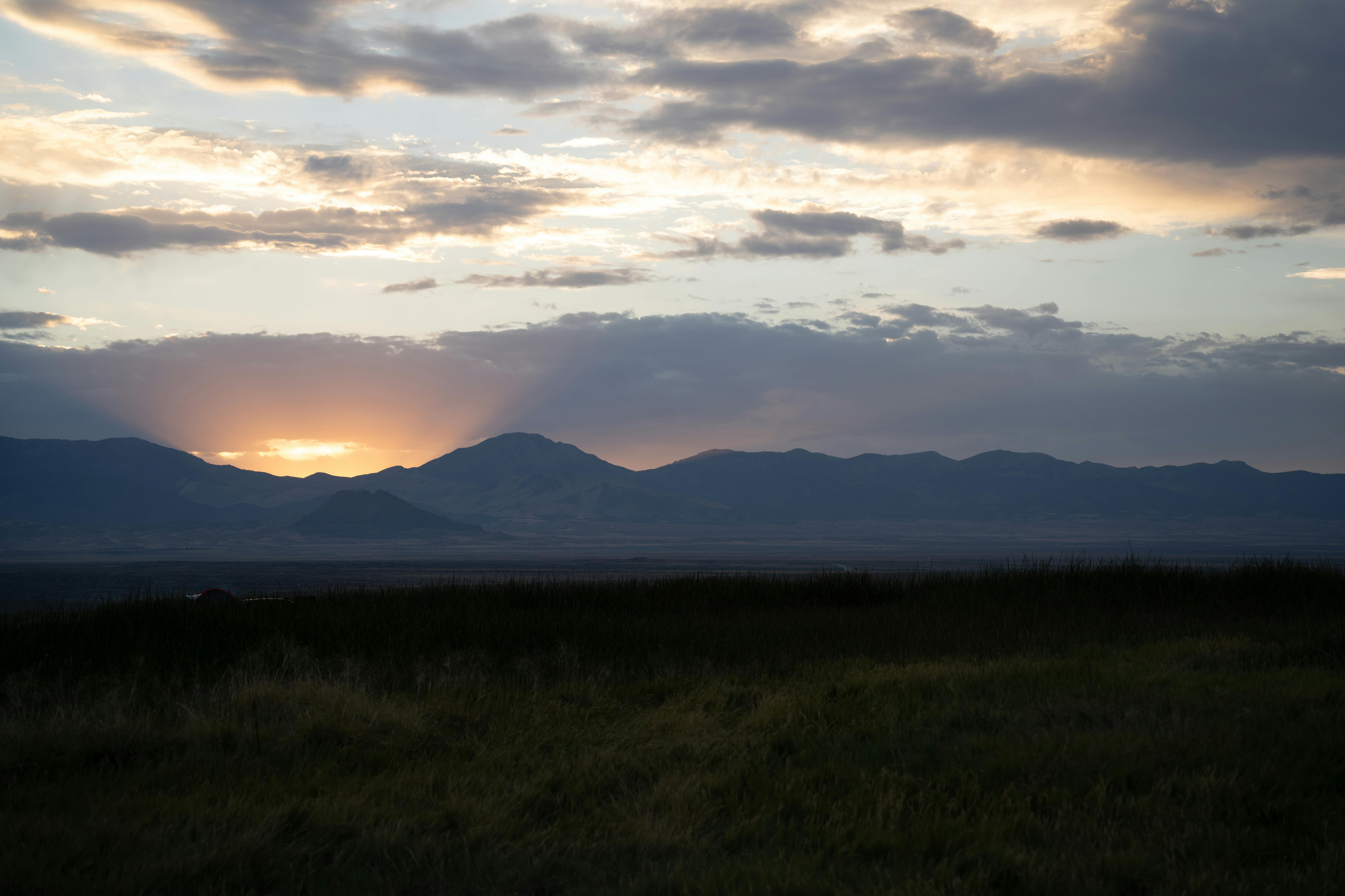 Grassland With View Of Sunset · Free Stock Photo