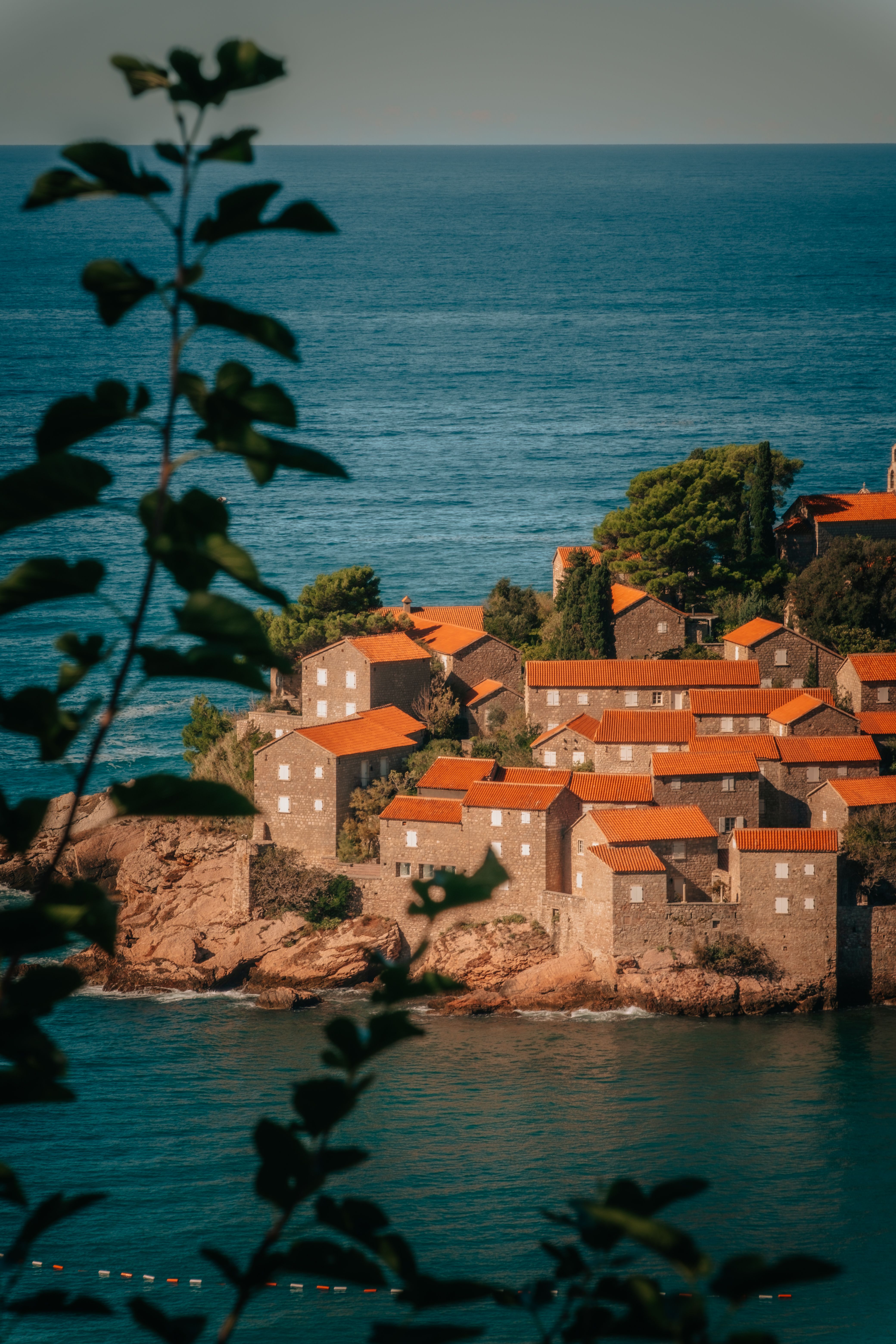 Charming Coastal Village with Orange Rooftops · Free Stock Photo
