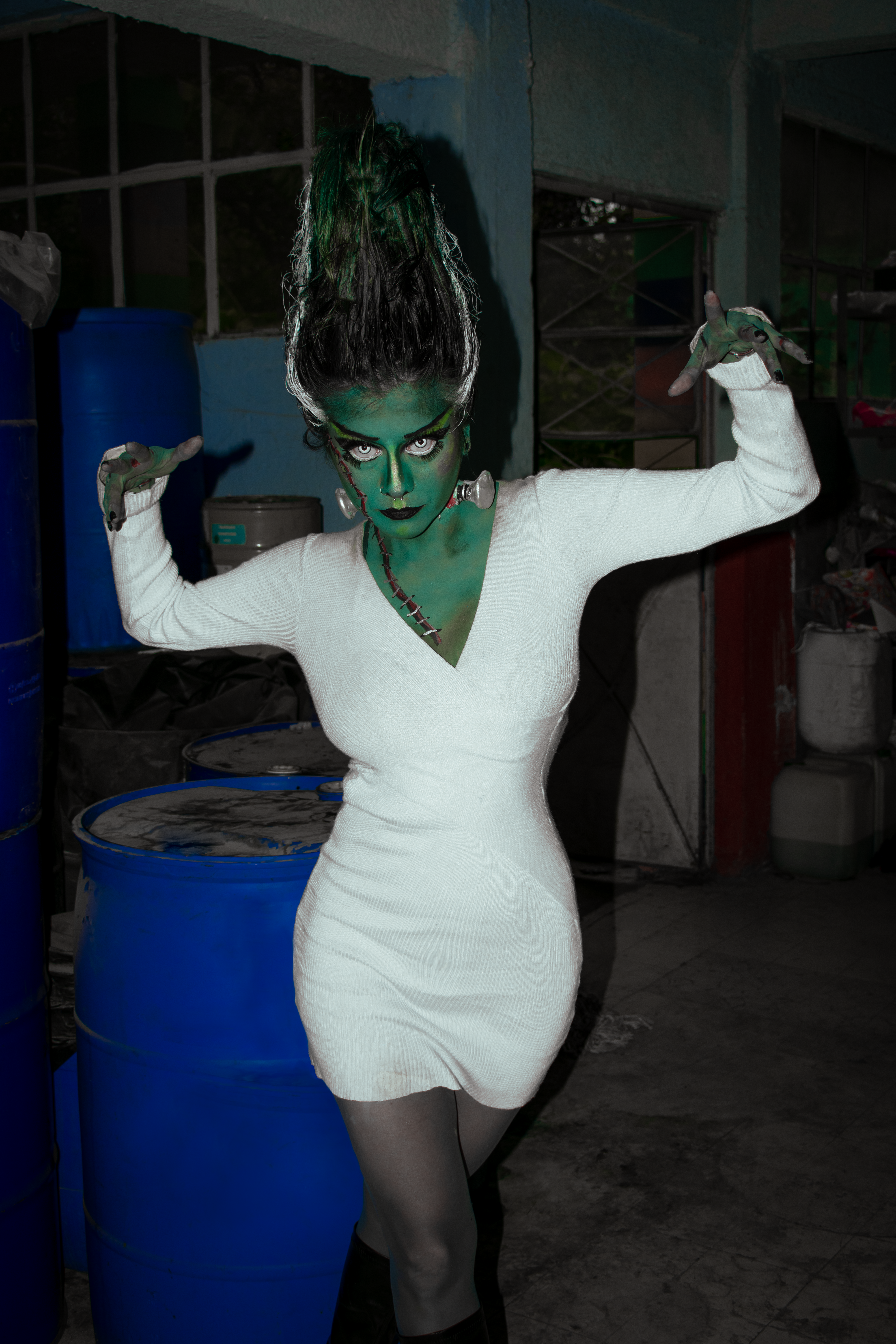 Green-skinned woman in costume posing dramatically · Free Stock Photo