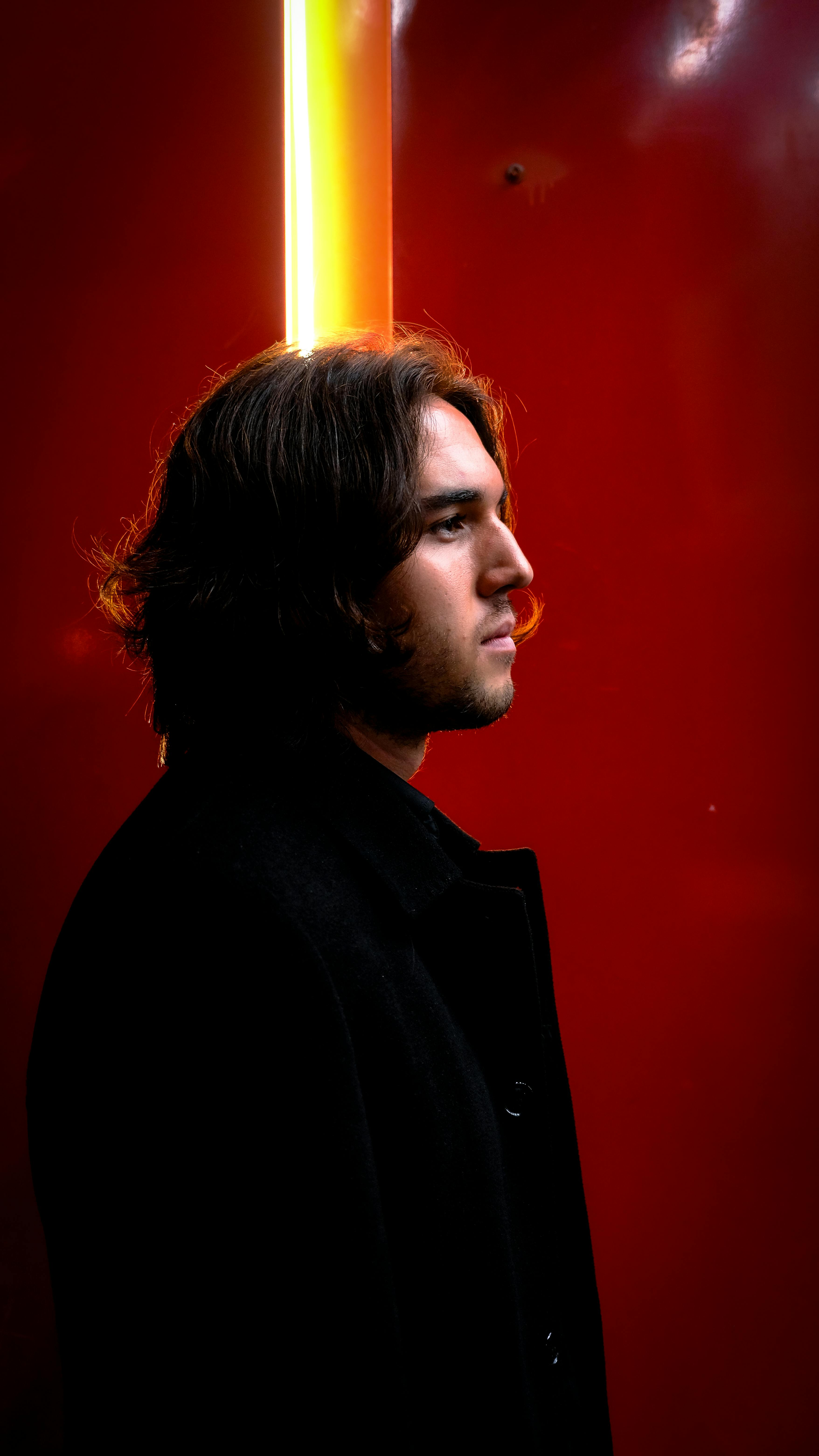 Dramatic Profile Portrait with Red Background · Free Stock Photo