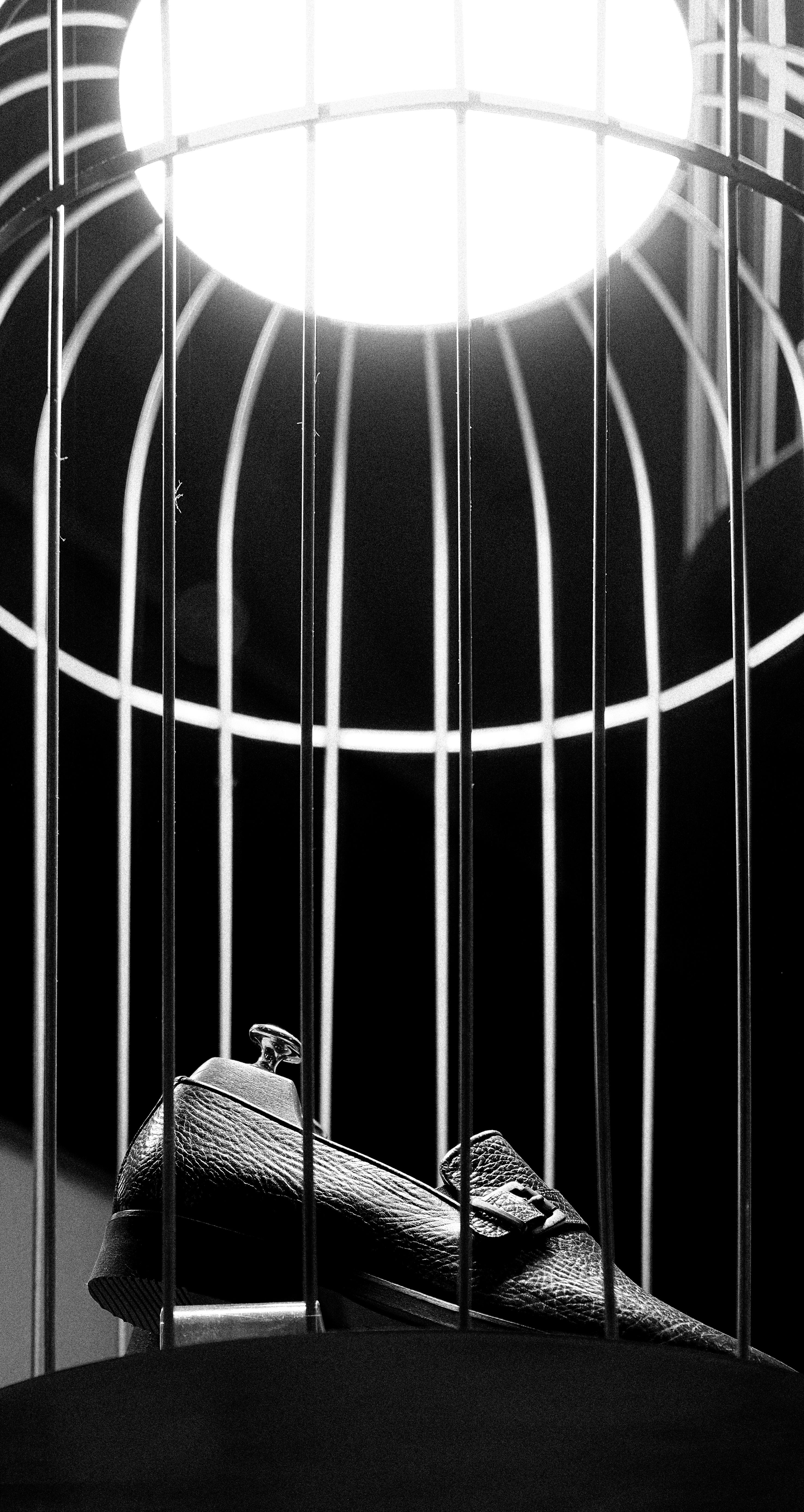 Monochrome Shoe Display in Dramatic Light · Free Stock Photo