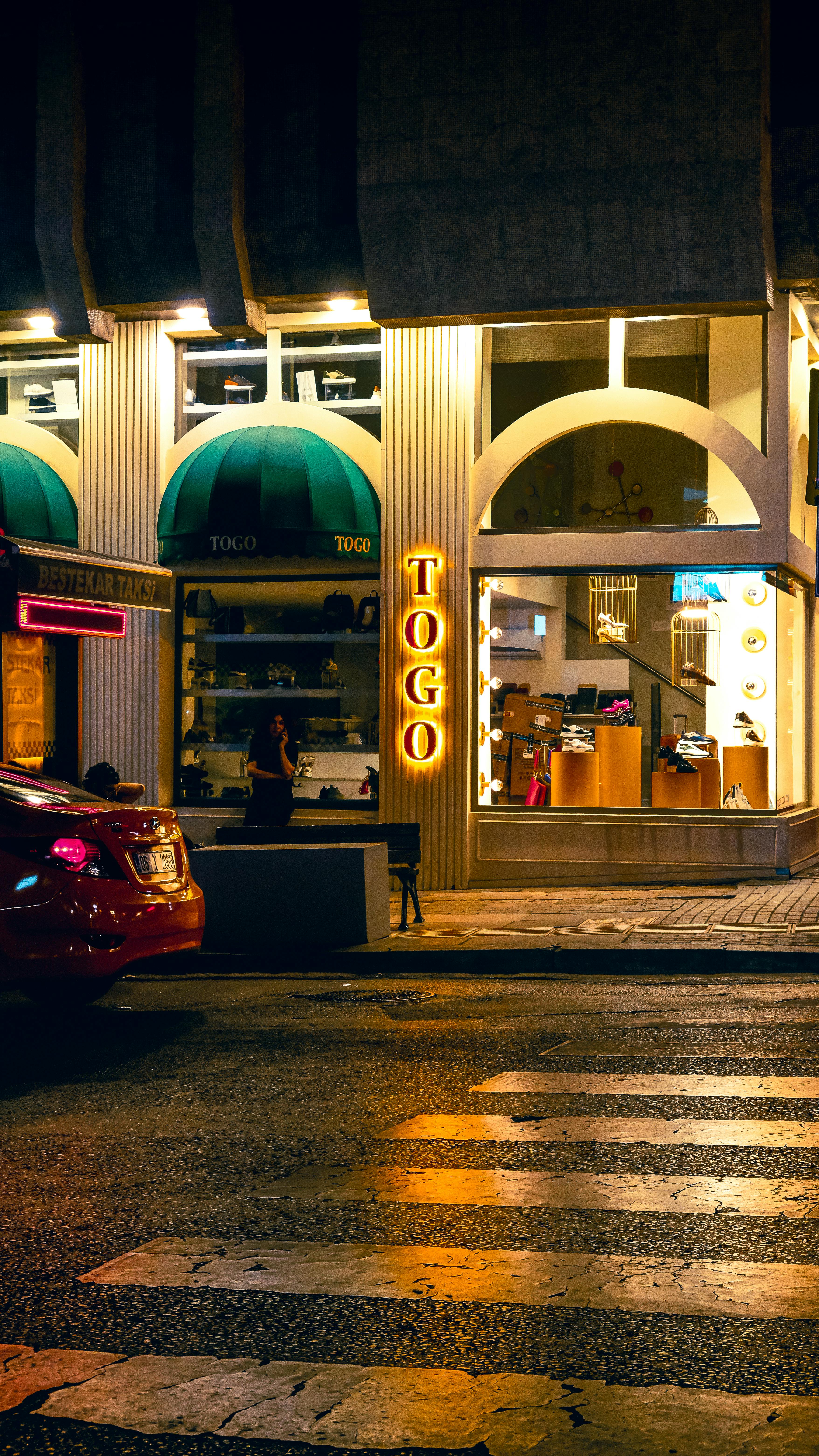 Illuminated Boutique Storefront at Night · Free Stock Photo
