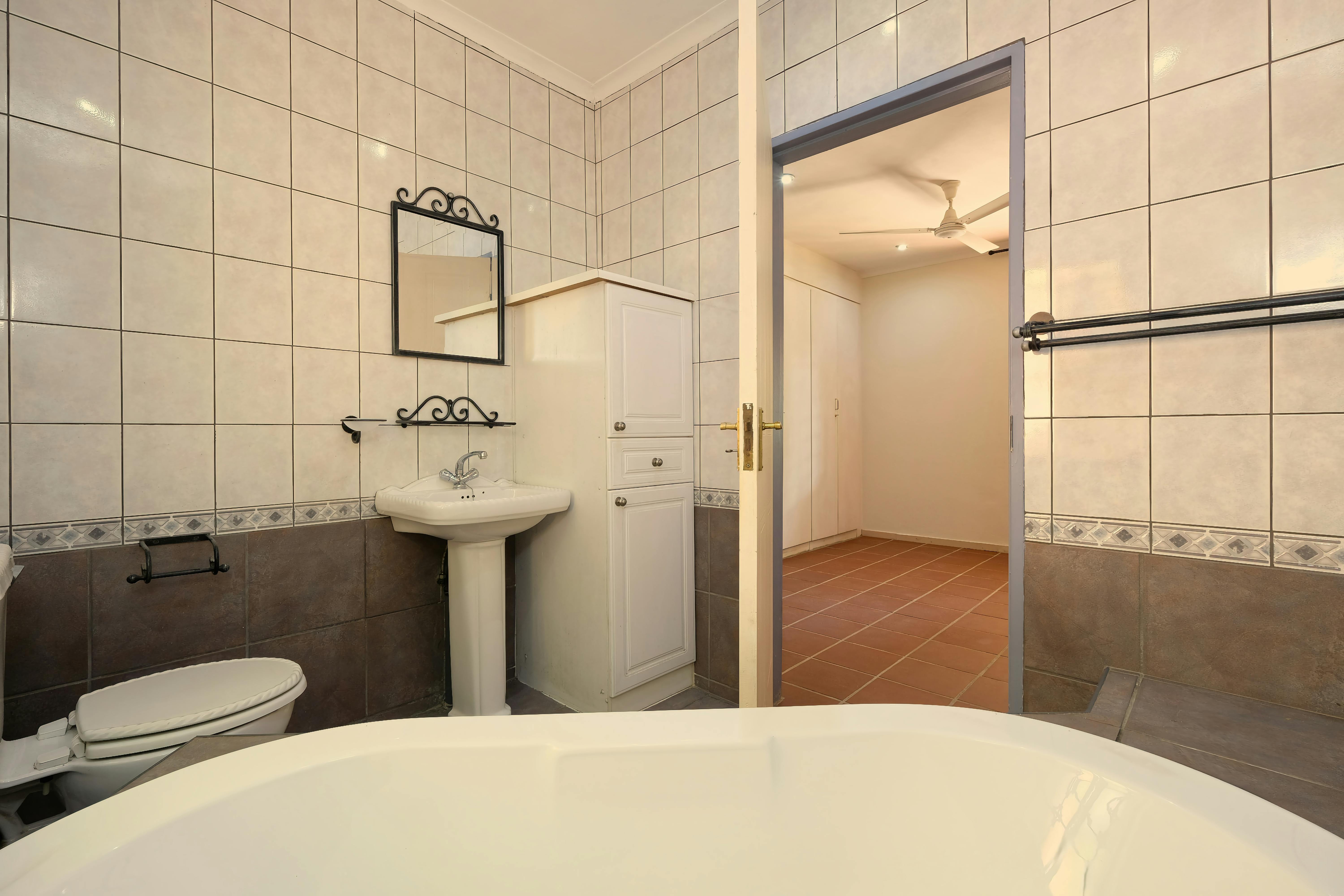 Elegant Tiled Bathroom with Classic Fixtures · Free Stock Photo