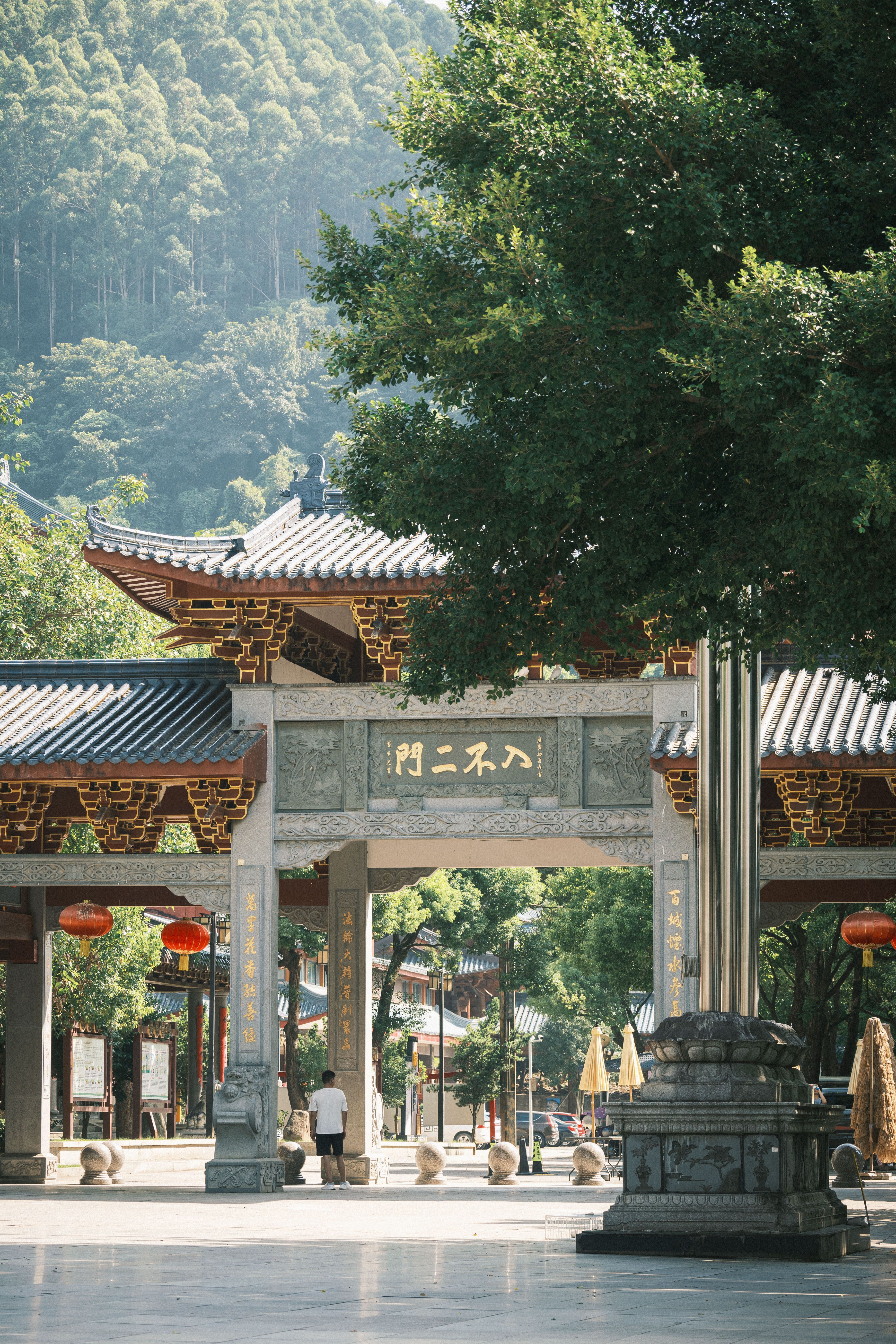 Traditional Chinese Gateway in Serene Forest Setting · Free Stock Photo