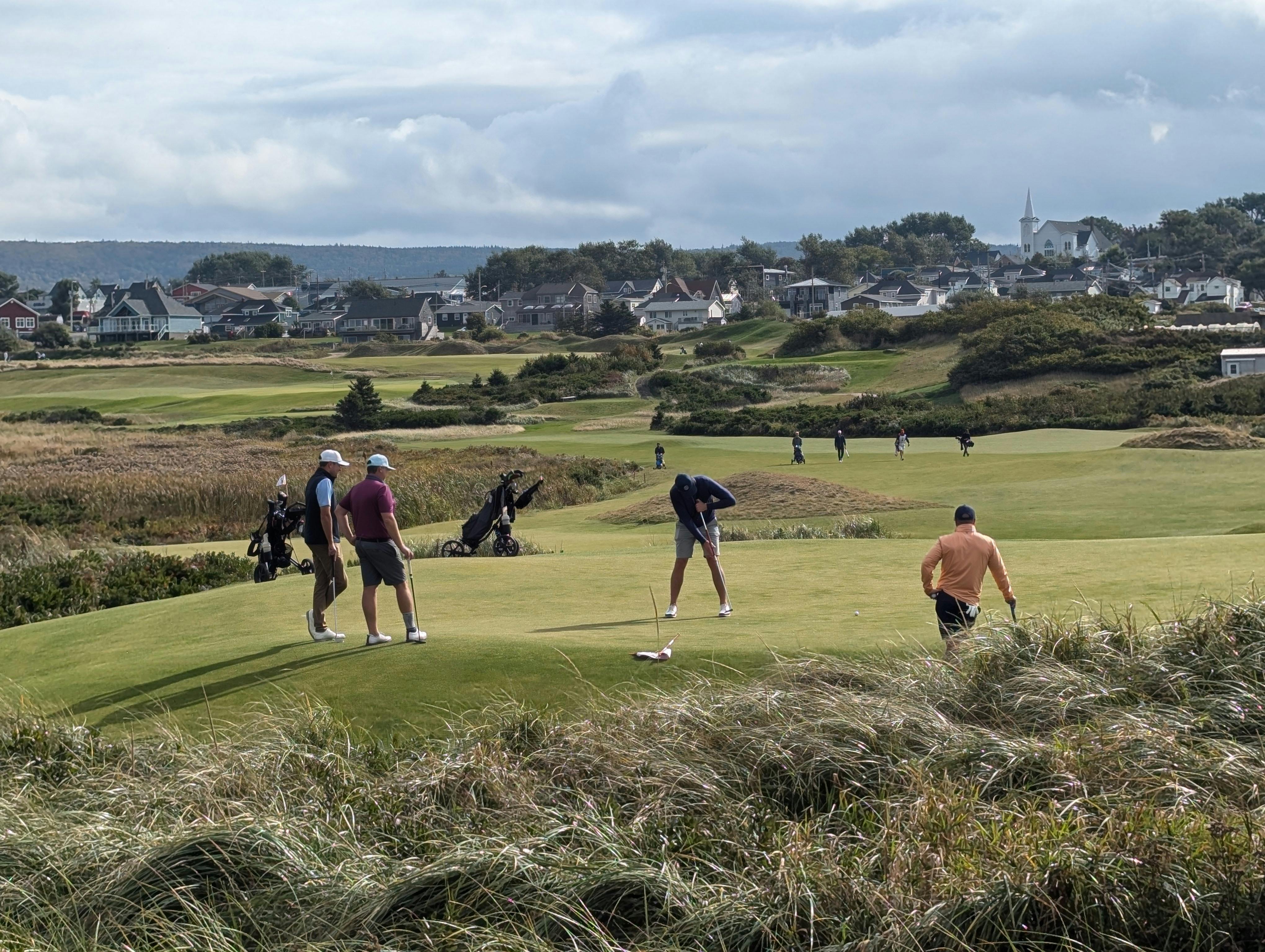 Golfers Playing on Scenic Cape Breton Golf Course · Free Stock Photo