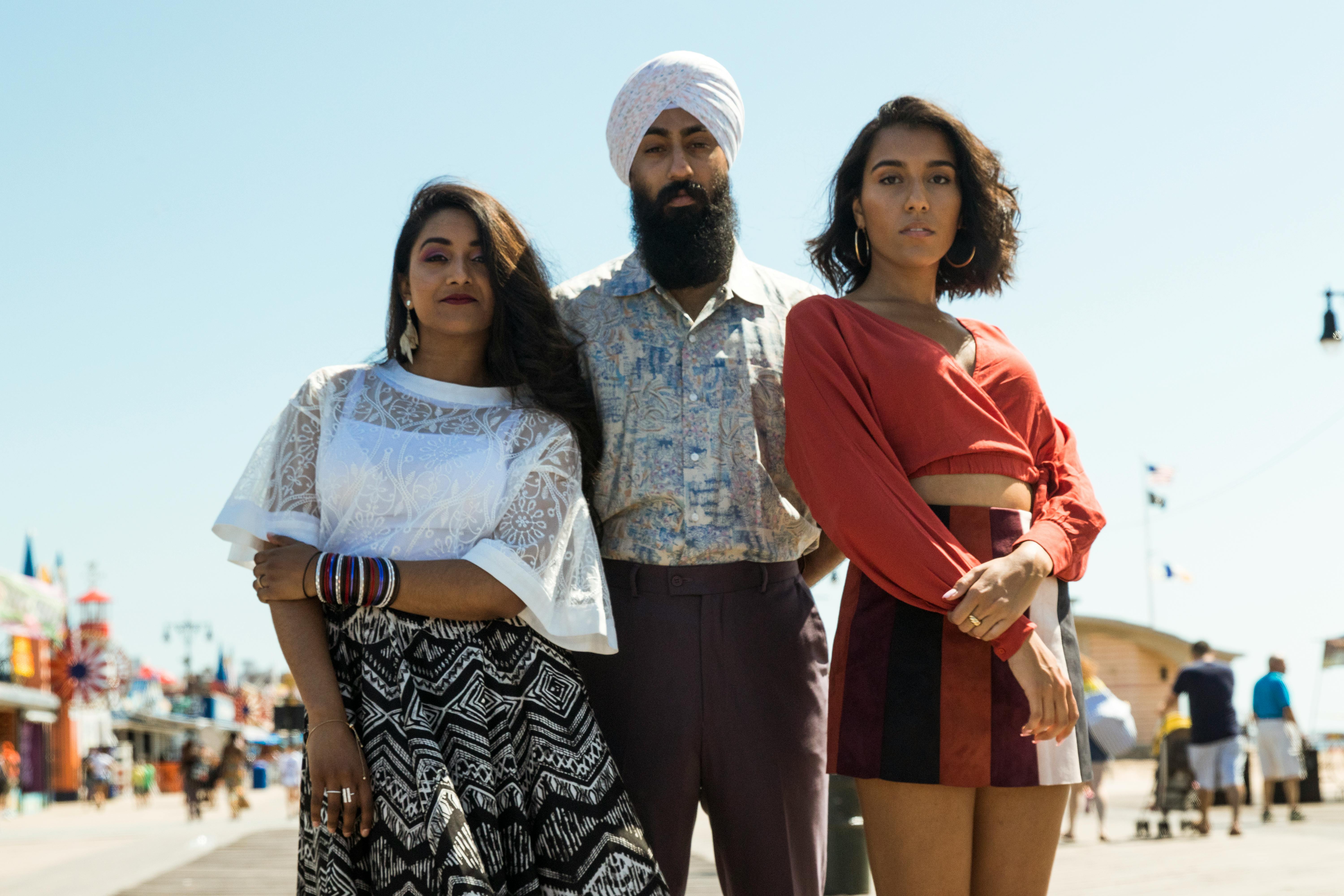 Man Standing Between Two Women · Free Stock Photo