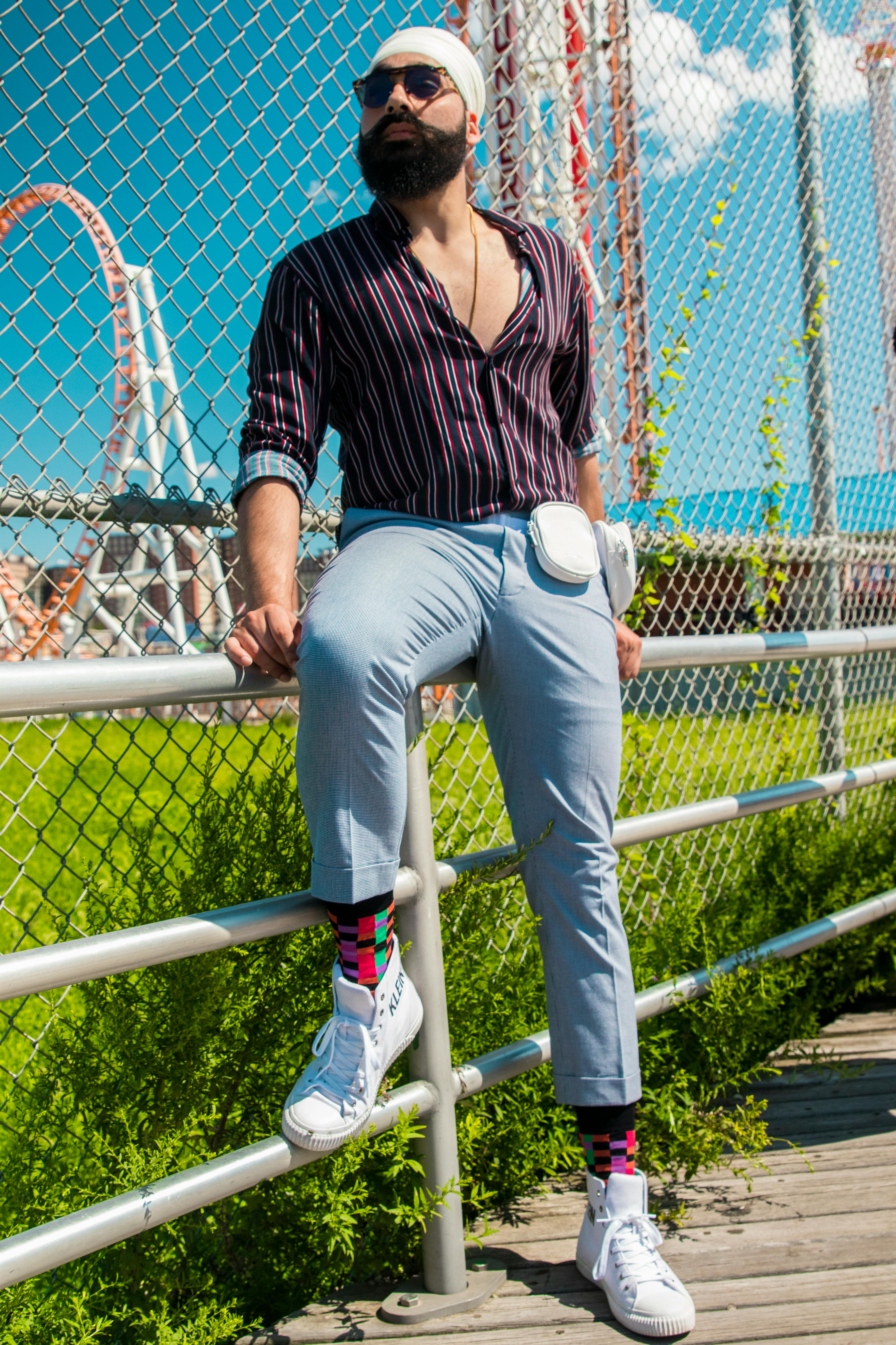 Man Sitting On A Railing · Free Stock Photo