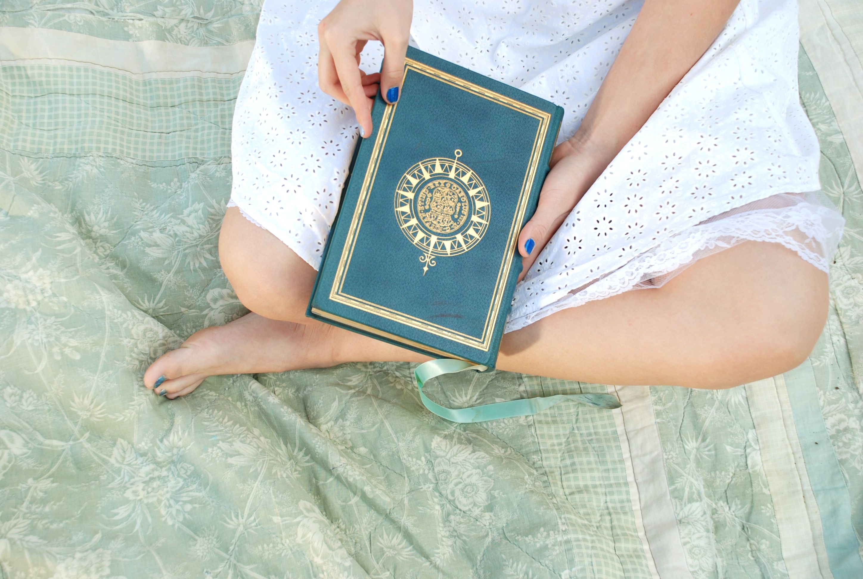 Woman Reading Antique Book on Picnic Blanket · Free Stock Photo
