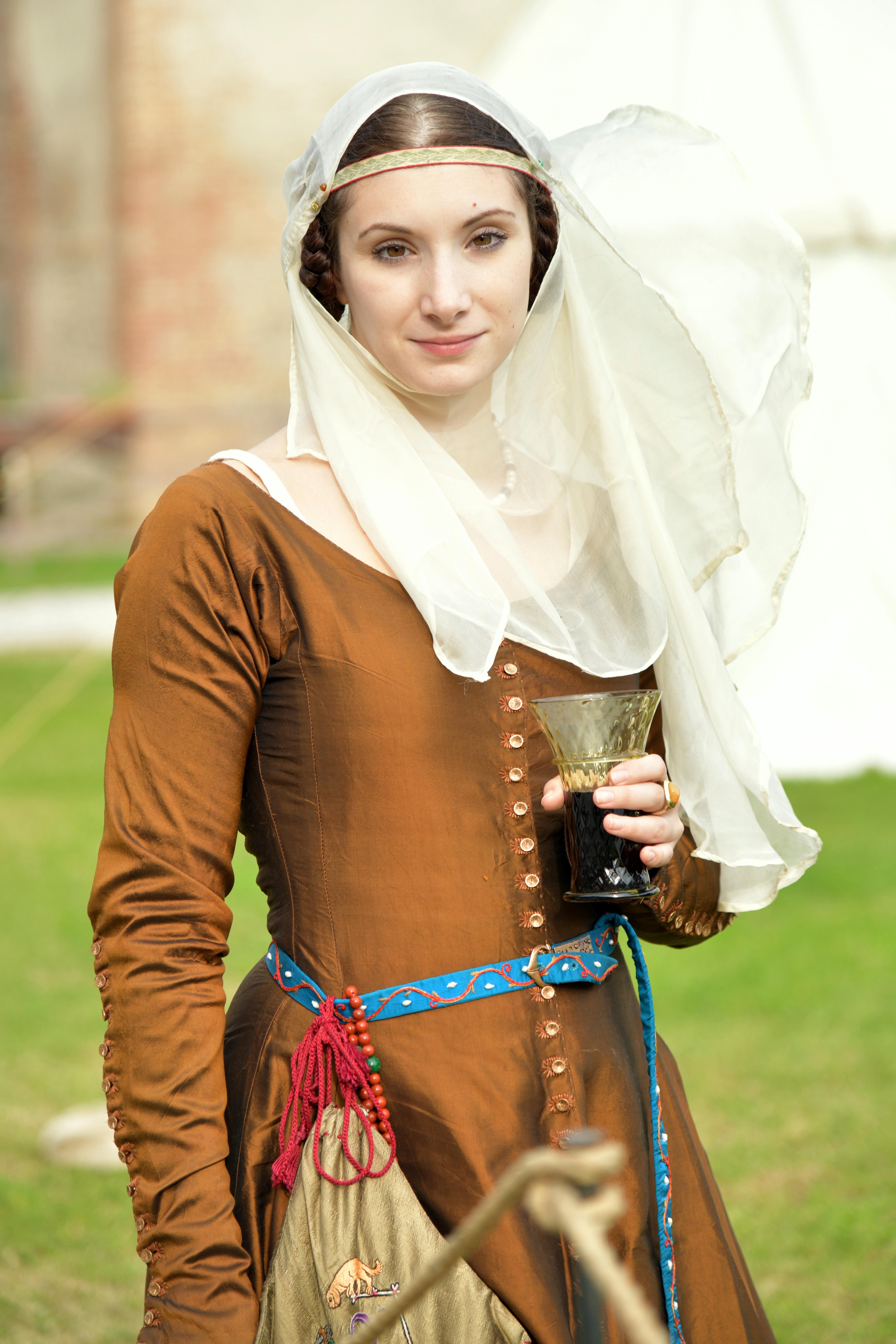 Medieval Woman in Traditional Costume with Drink · Free Stock Photo