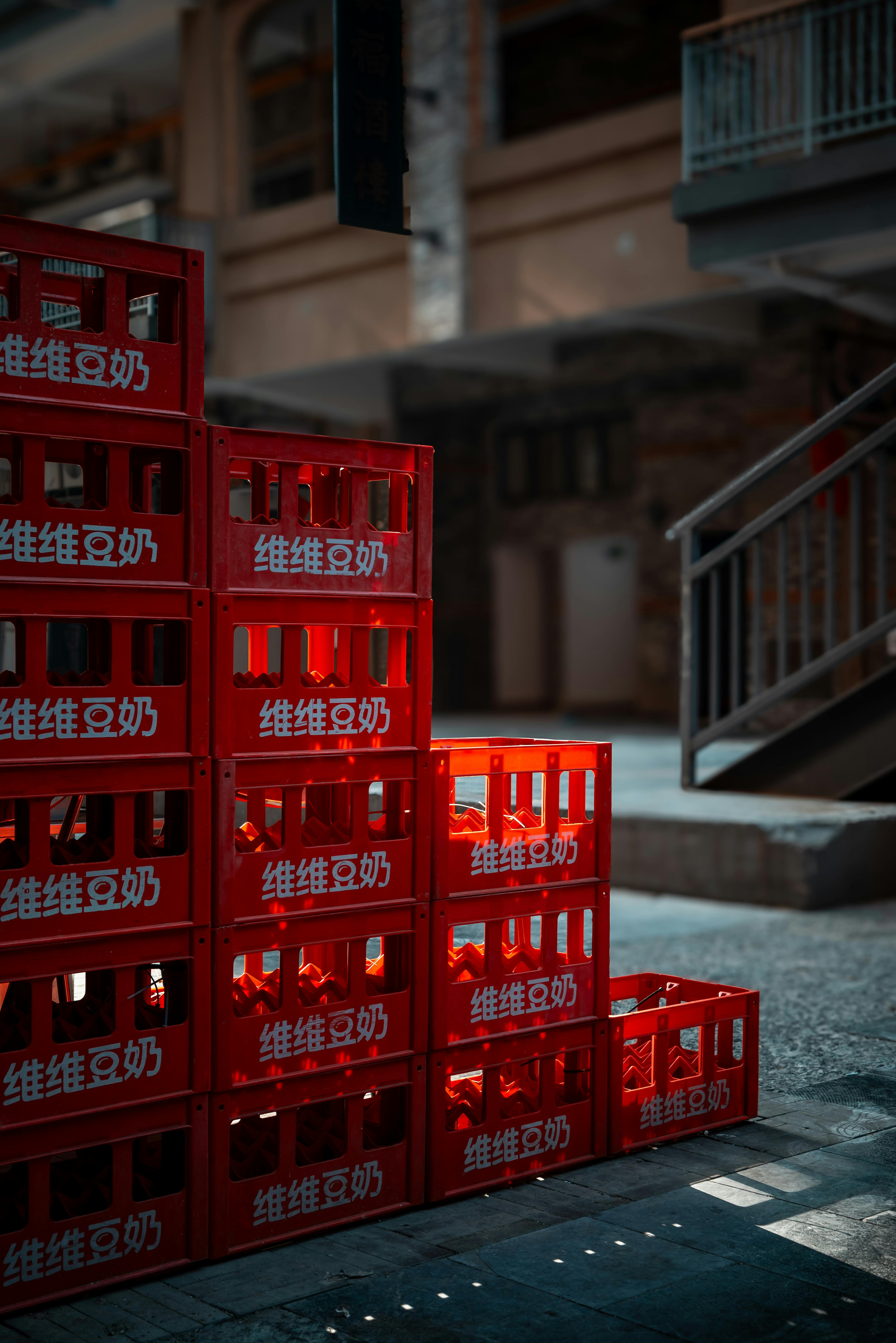 Stack of Red Crates in Urban Setting · Free Stock Photo