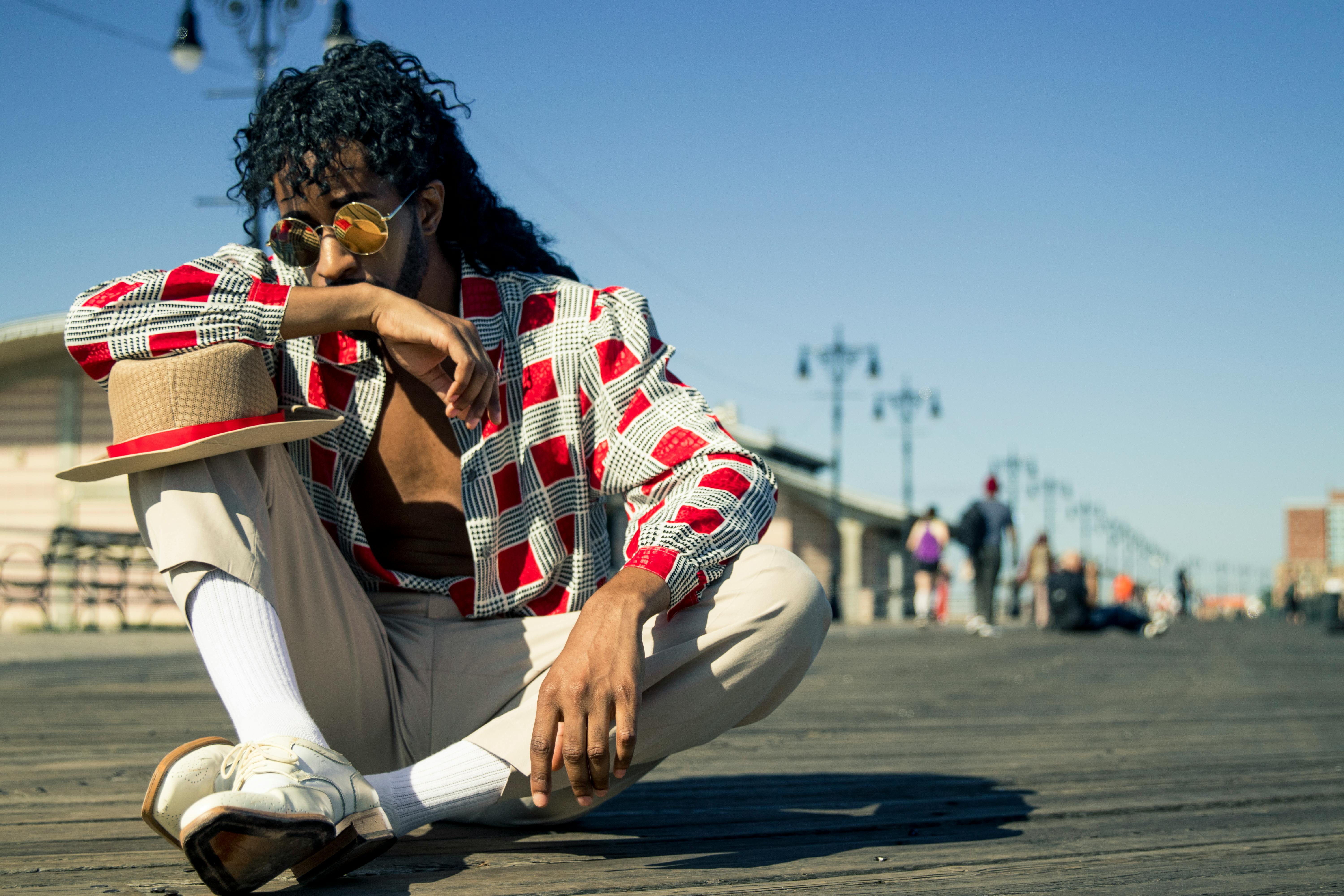 Man Sitting on Road · Free Stock Photo