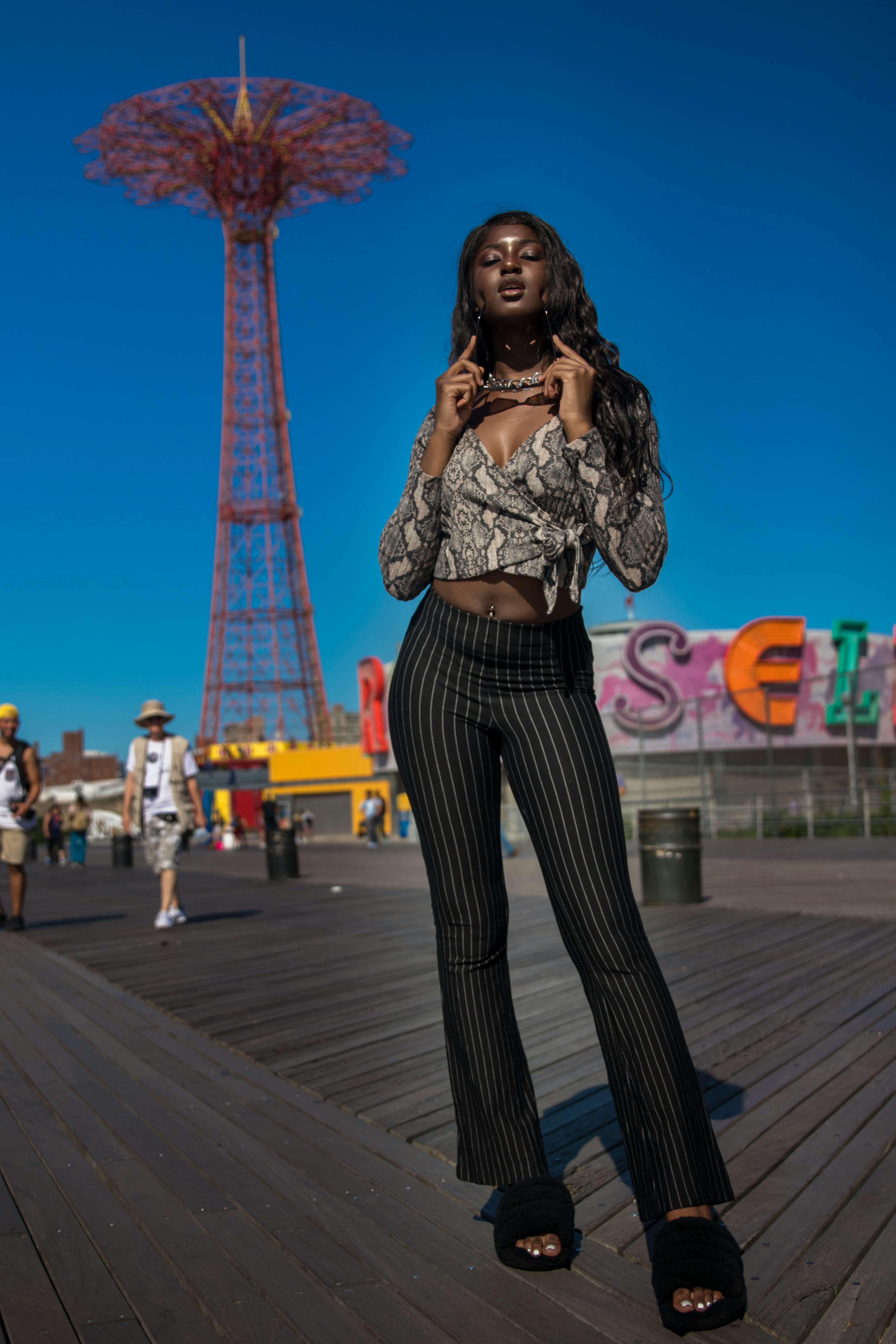 Woman Standing on Boardwalk · Free Stock Photo
