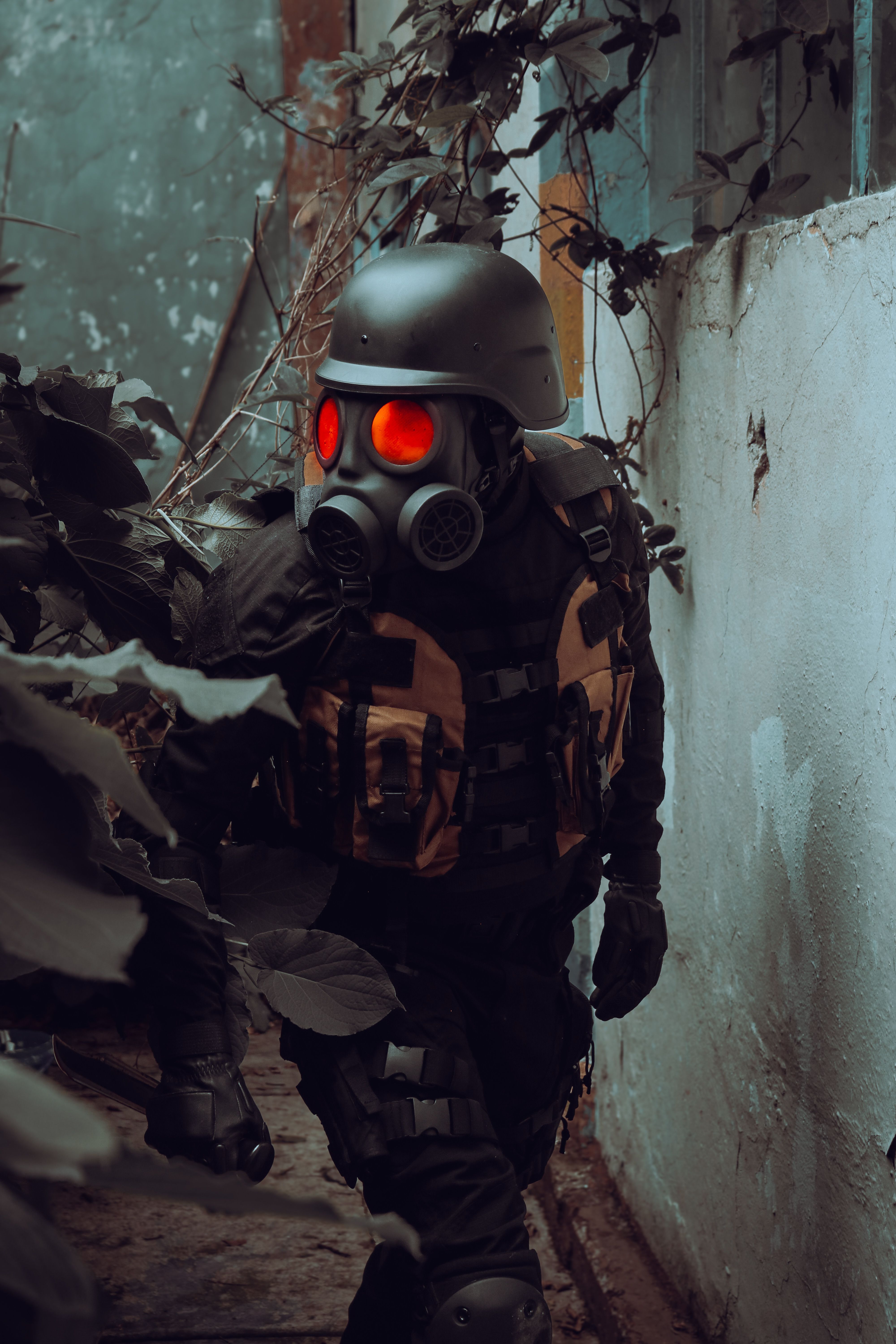Person in Tactical Gear with Glowing Red Goggles · Free Stock Photo