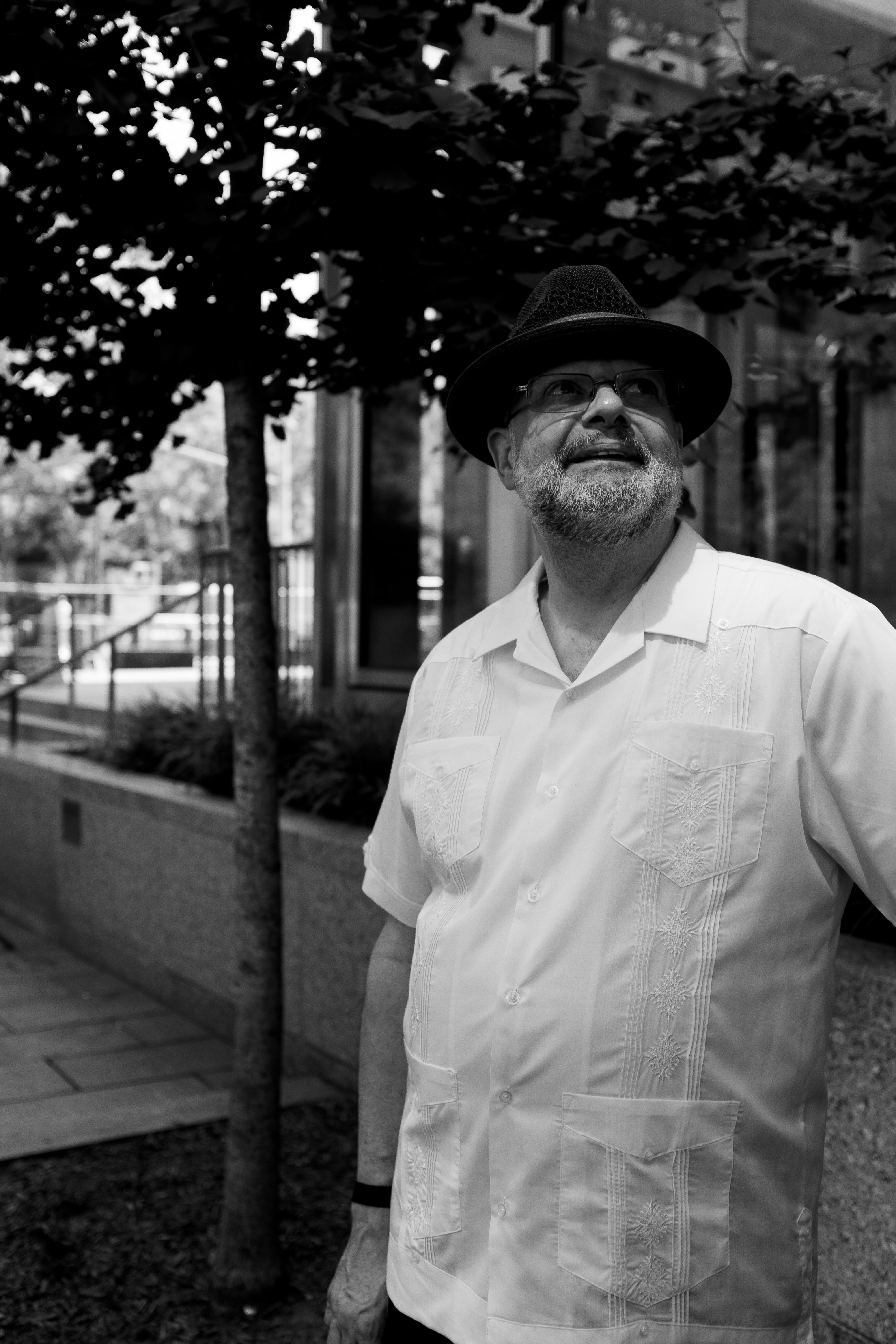 Gray-scale Photo of Man Wearing Hat · Free Stock Photo