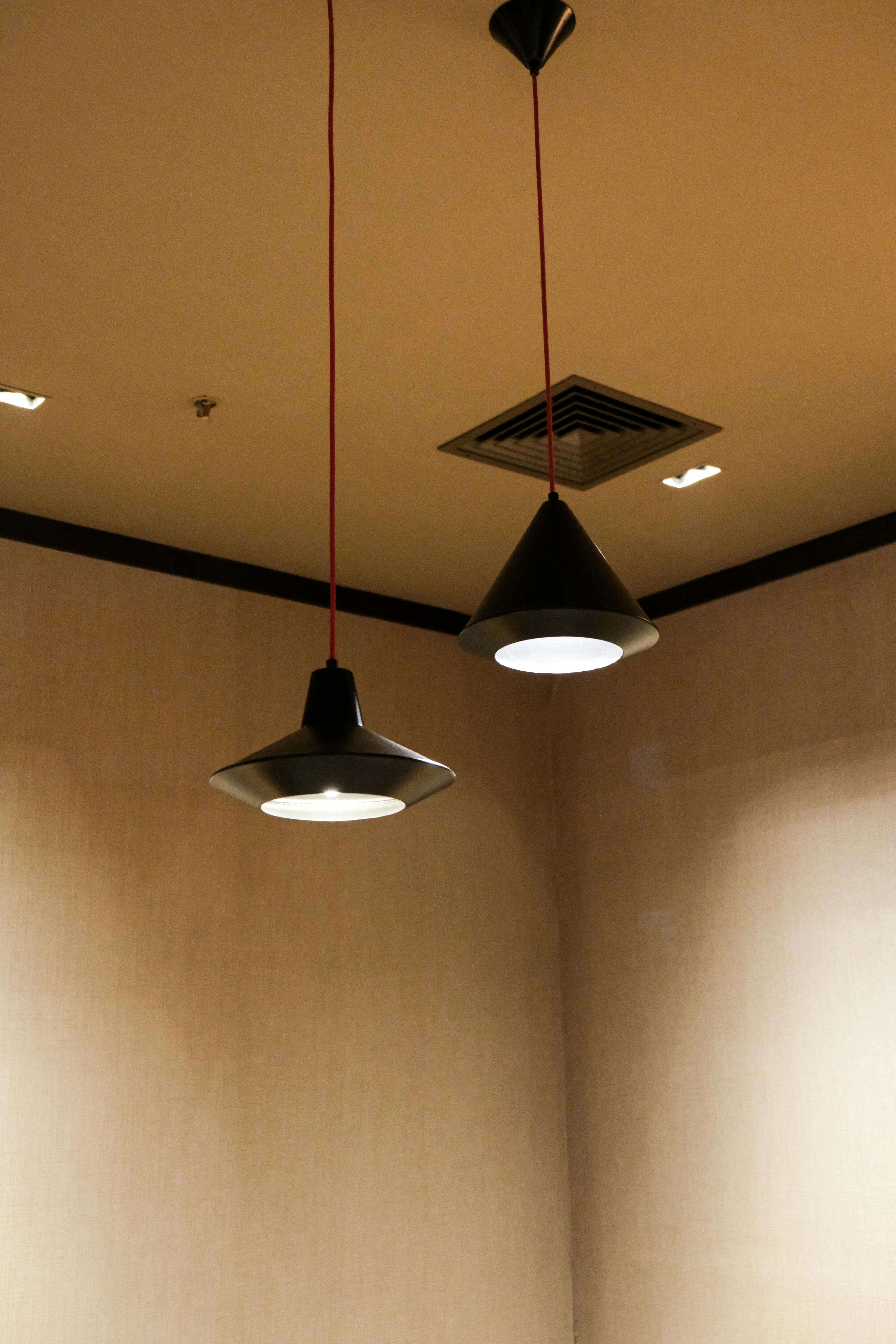 Modern Hanging Pendant Lamps in Minimalist Interior · Free Stock Photo