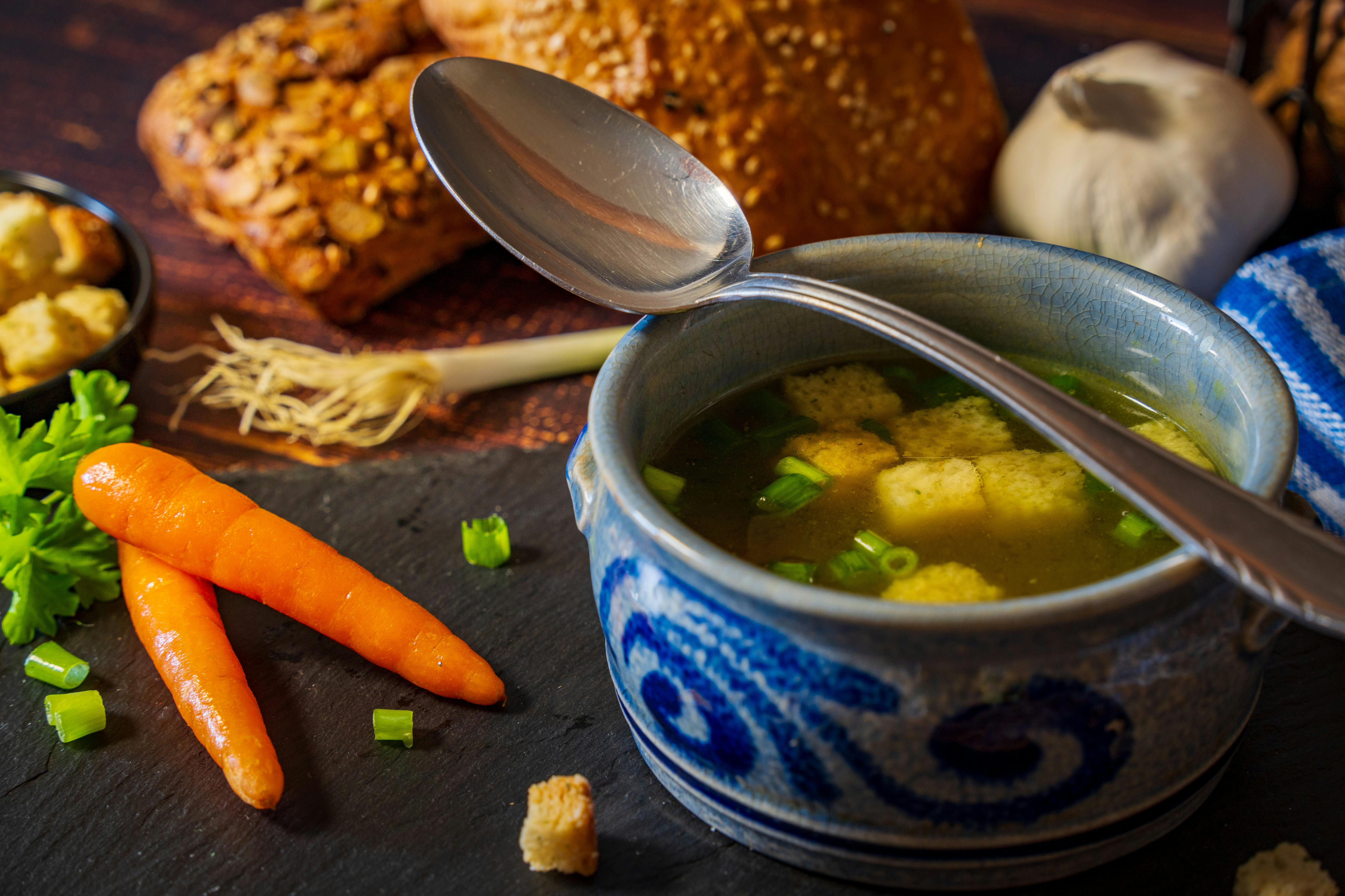 Warm Vegetable Broth with Fresh Bread and Herbs · Free Stock Photo