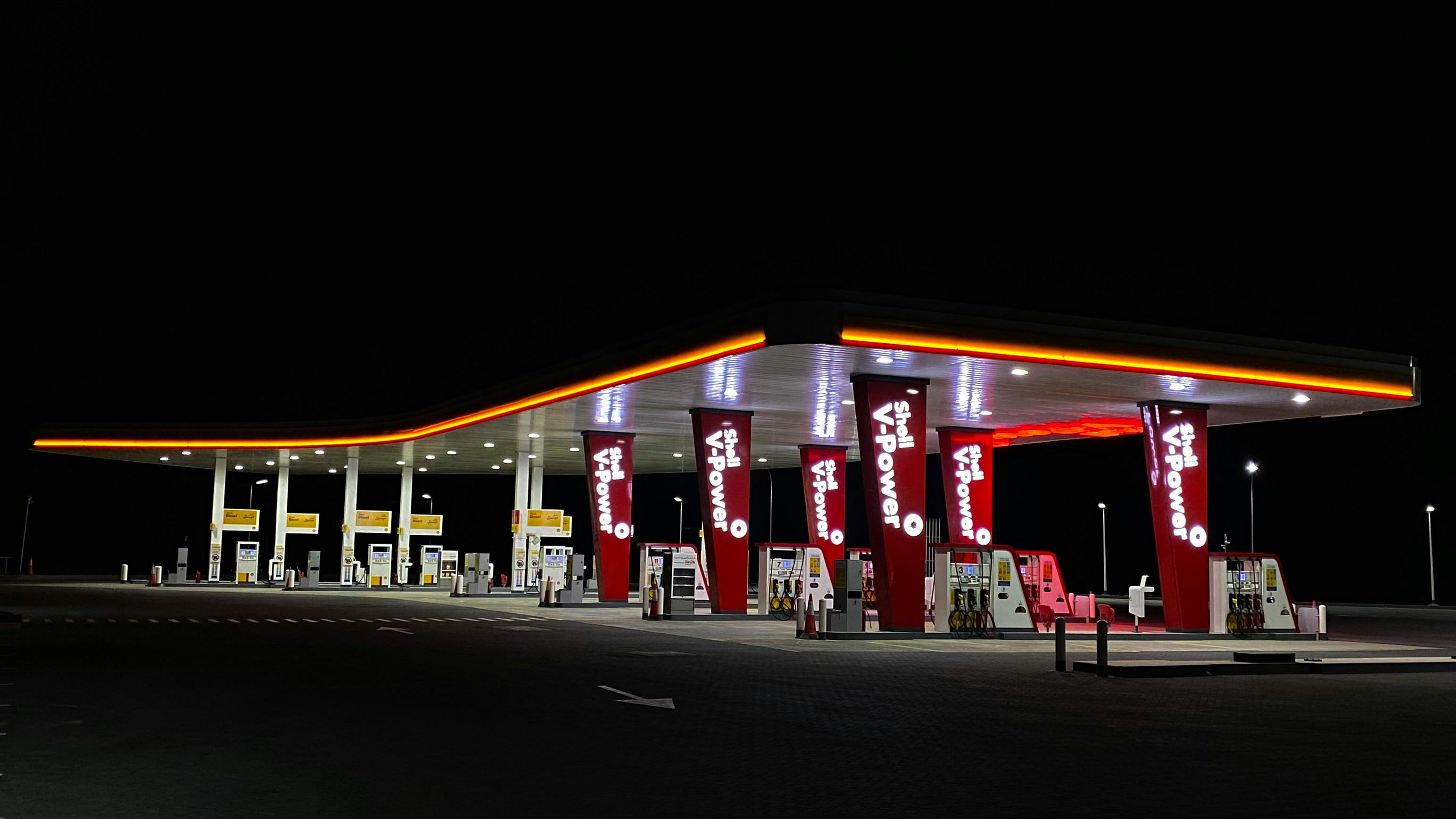 Illuminated Shell Petrol Station at Night in Oman · Free Stock Photo