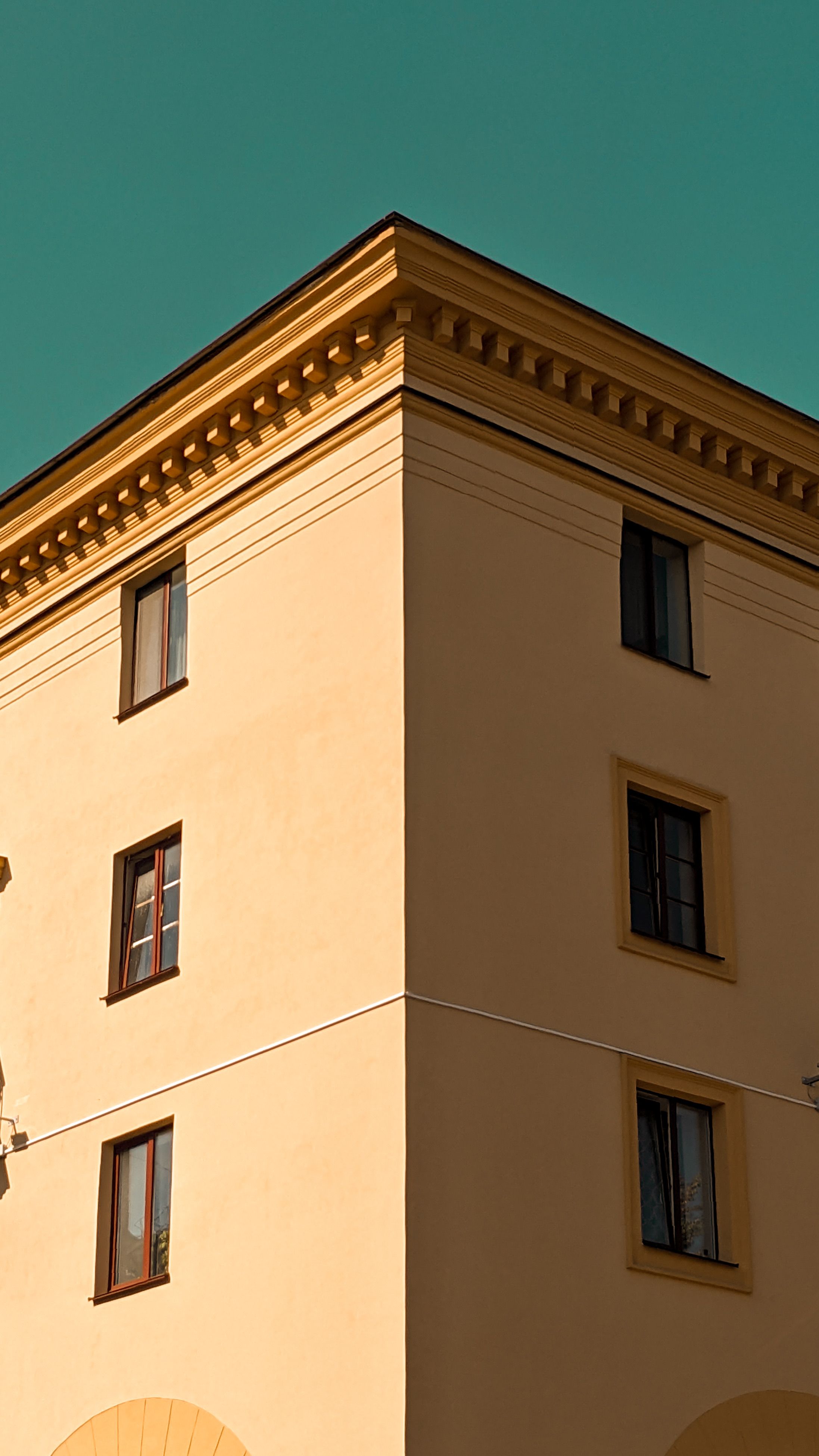 Classic Yellow Building Against Clear Sky · Free Stock Photo