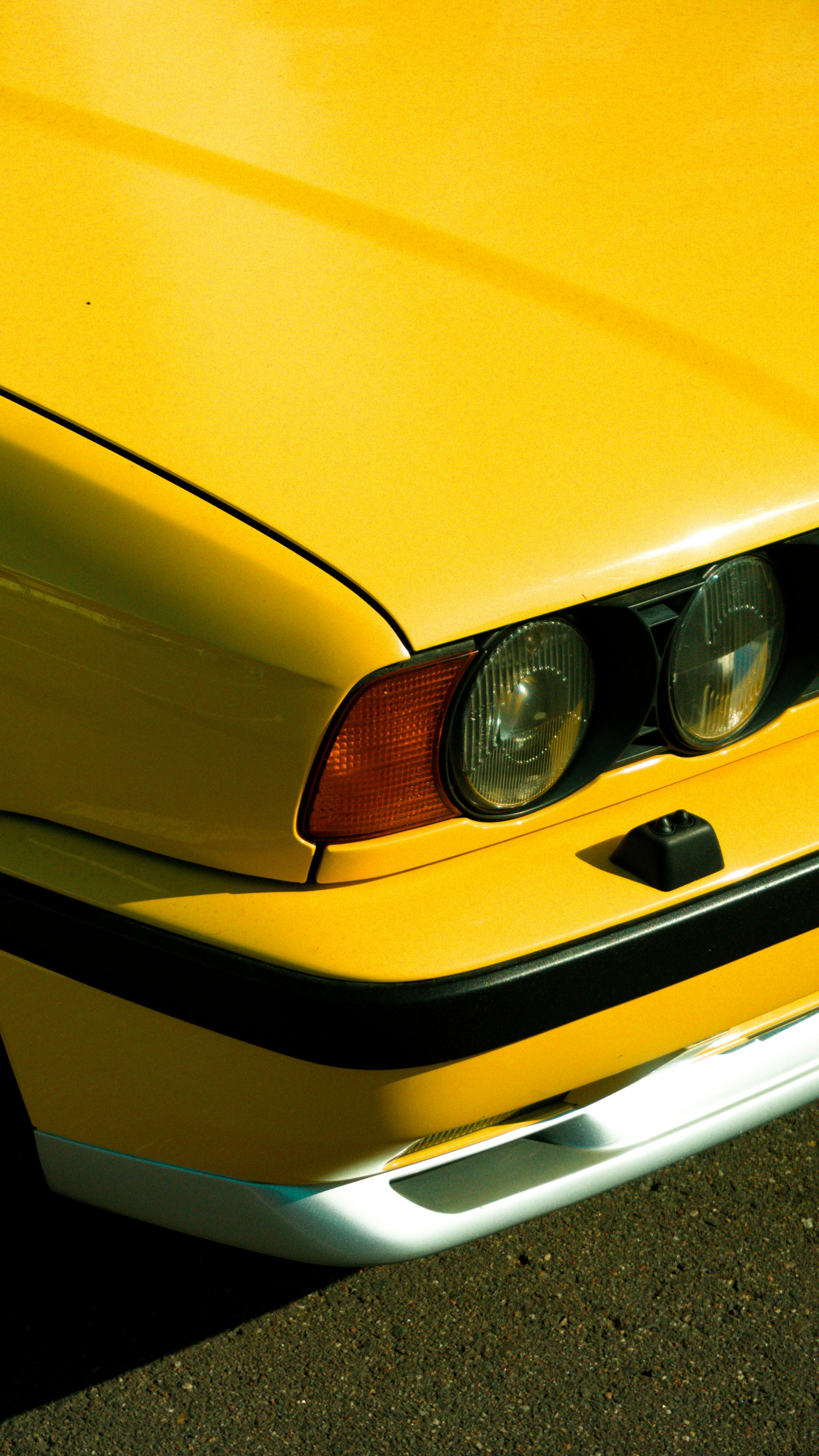 Close-up of Classic Yellow Car Front Bumper · Free Stock Photo
