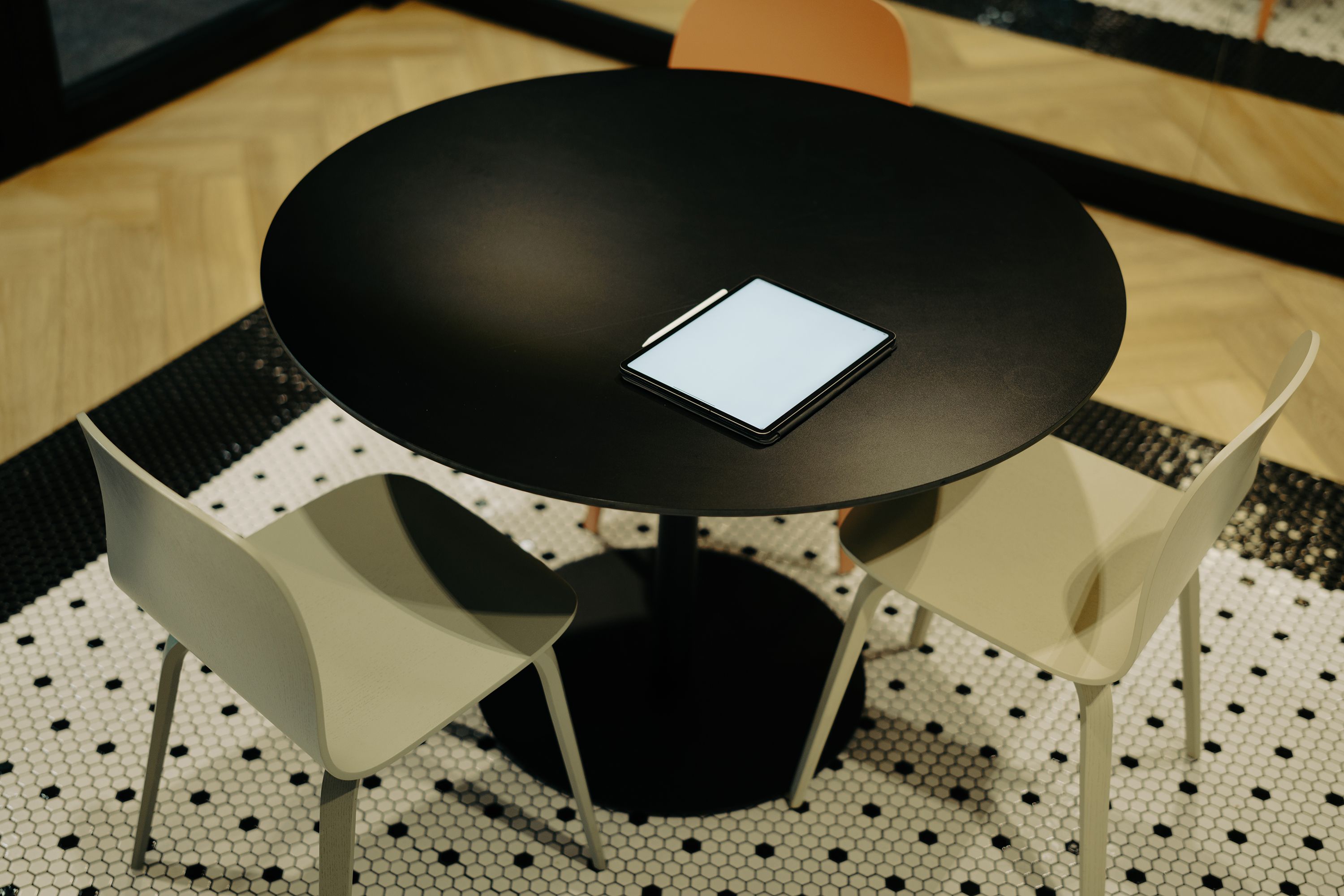 Modern Office Space with Tablet on Round Table · Free Stock Photo