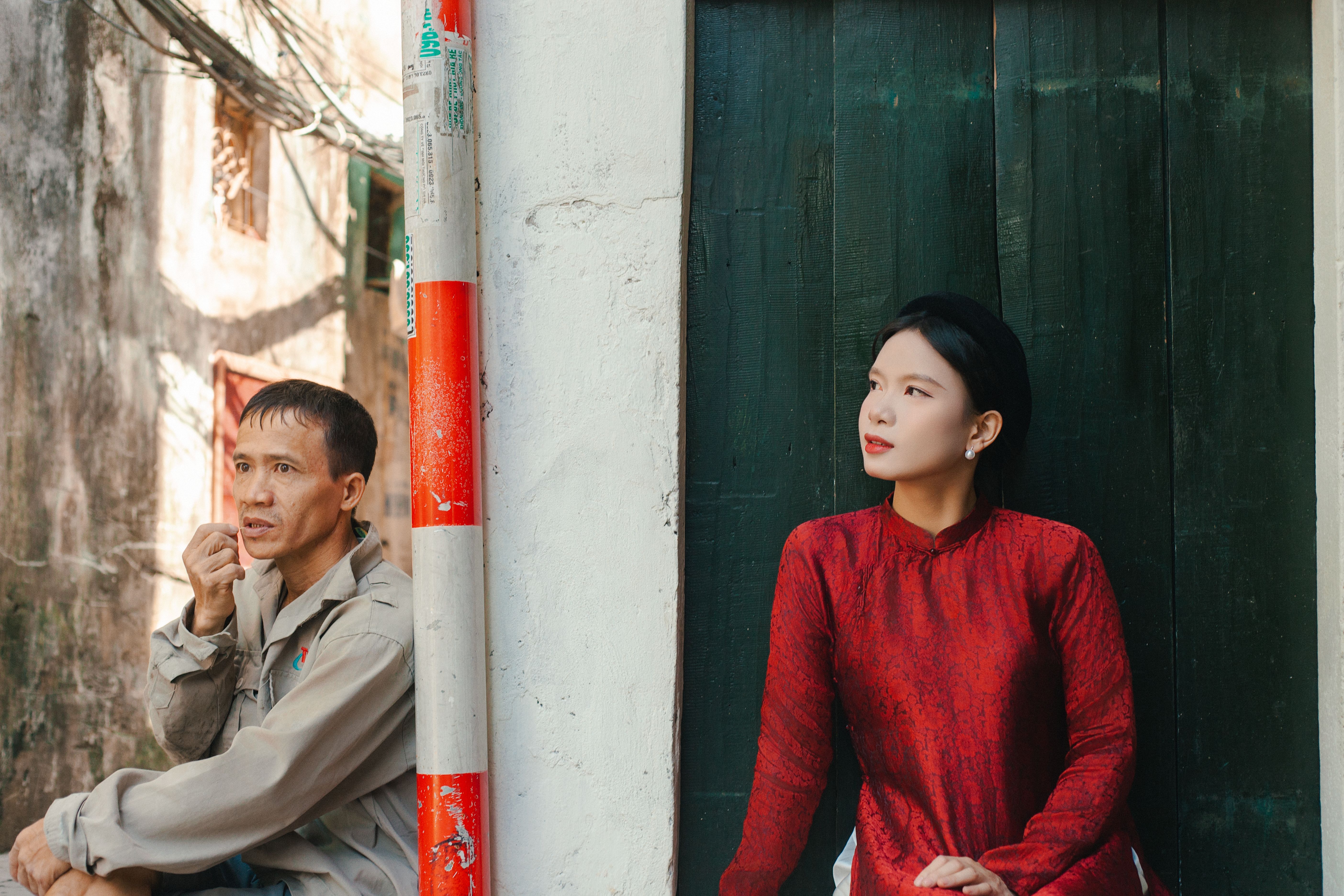 Traditional Vietnamese Attire in Hanoi Alley · Free Stock Photo