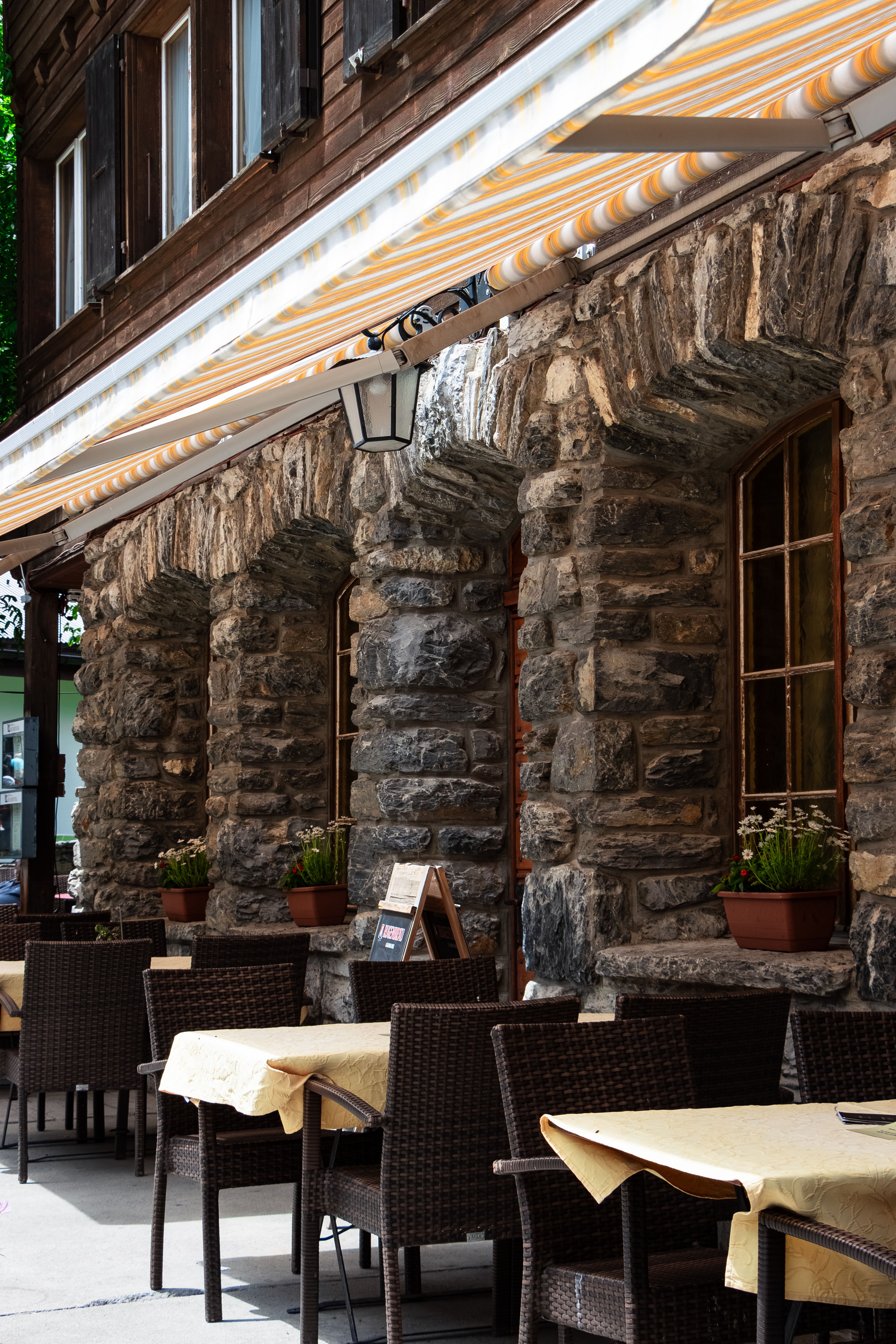 Charming Swiss Stone Restaurant Exterior in Summer · Free Stock Photo