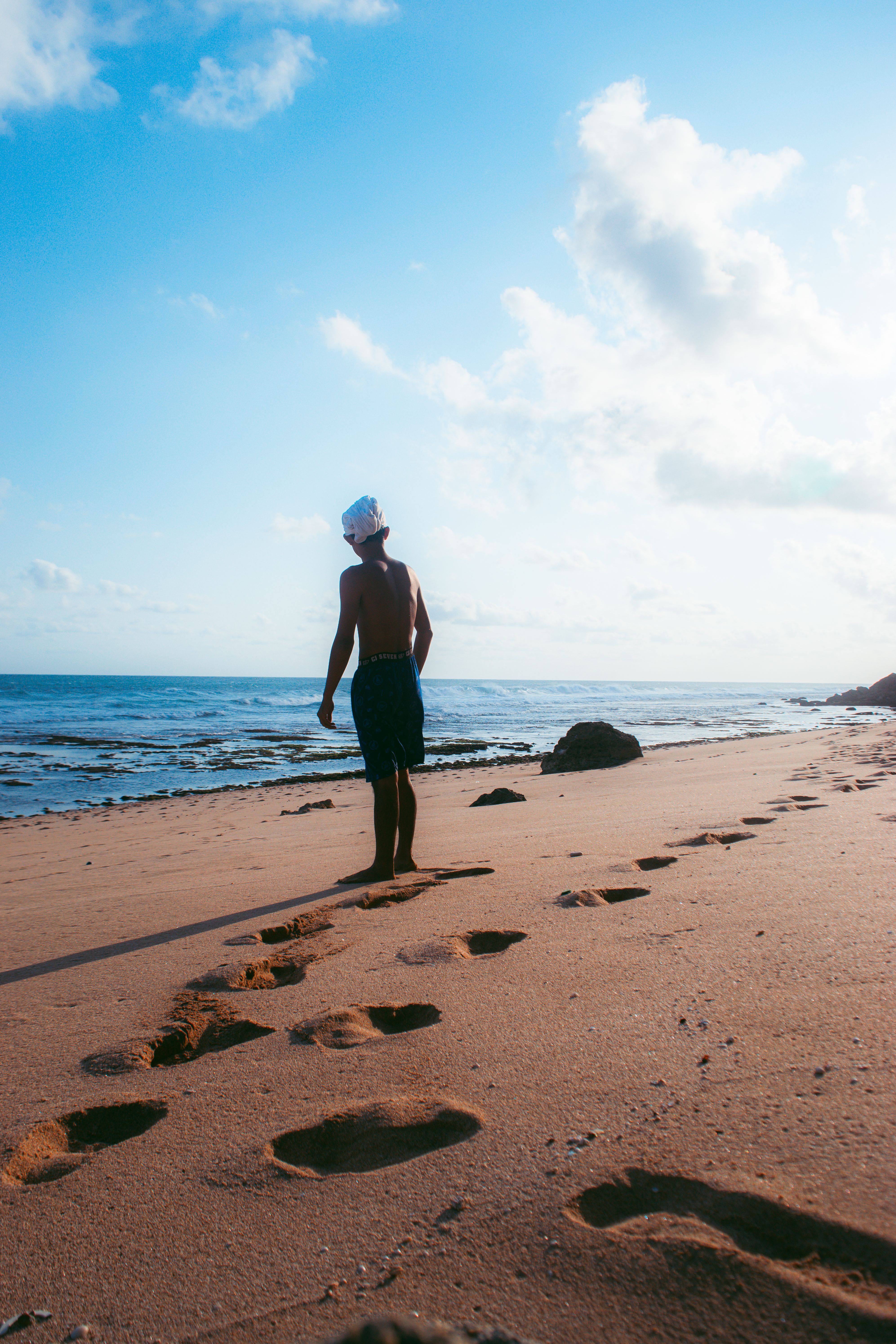 Back View of Person Walking on Yogyakarta Beach · Free Stock Photo
