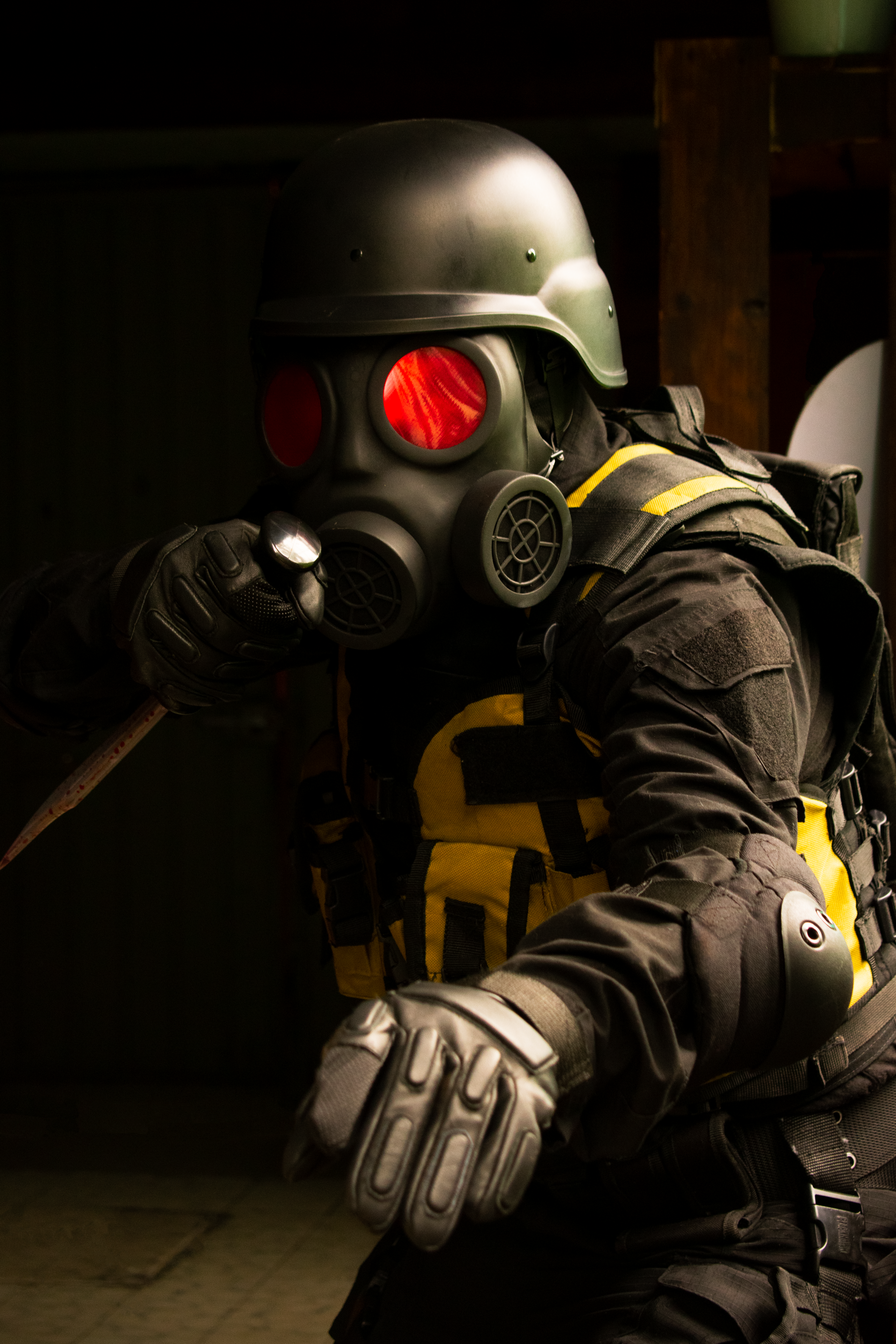 Man in Gas Mask Standing with Pistol · Free Stock Photo