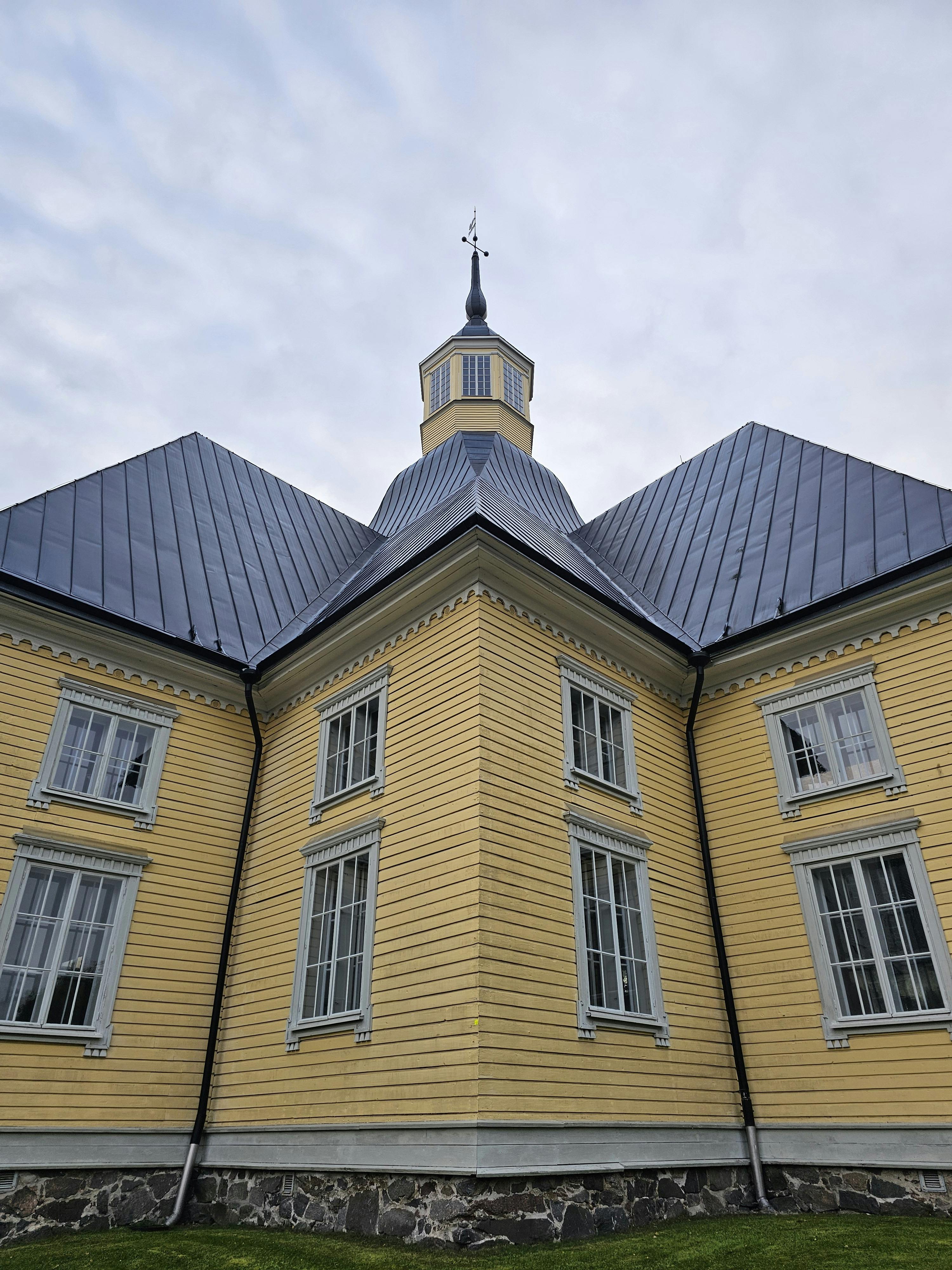 Yellow Wooden Church in Finnish Landscape · Free Stock Photo