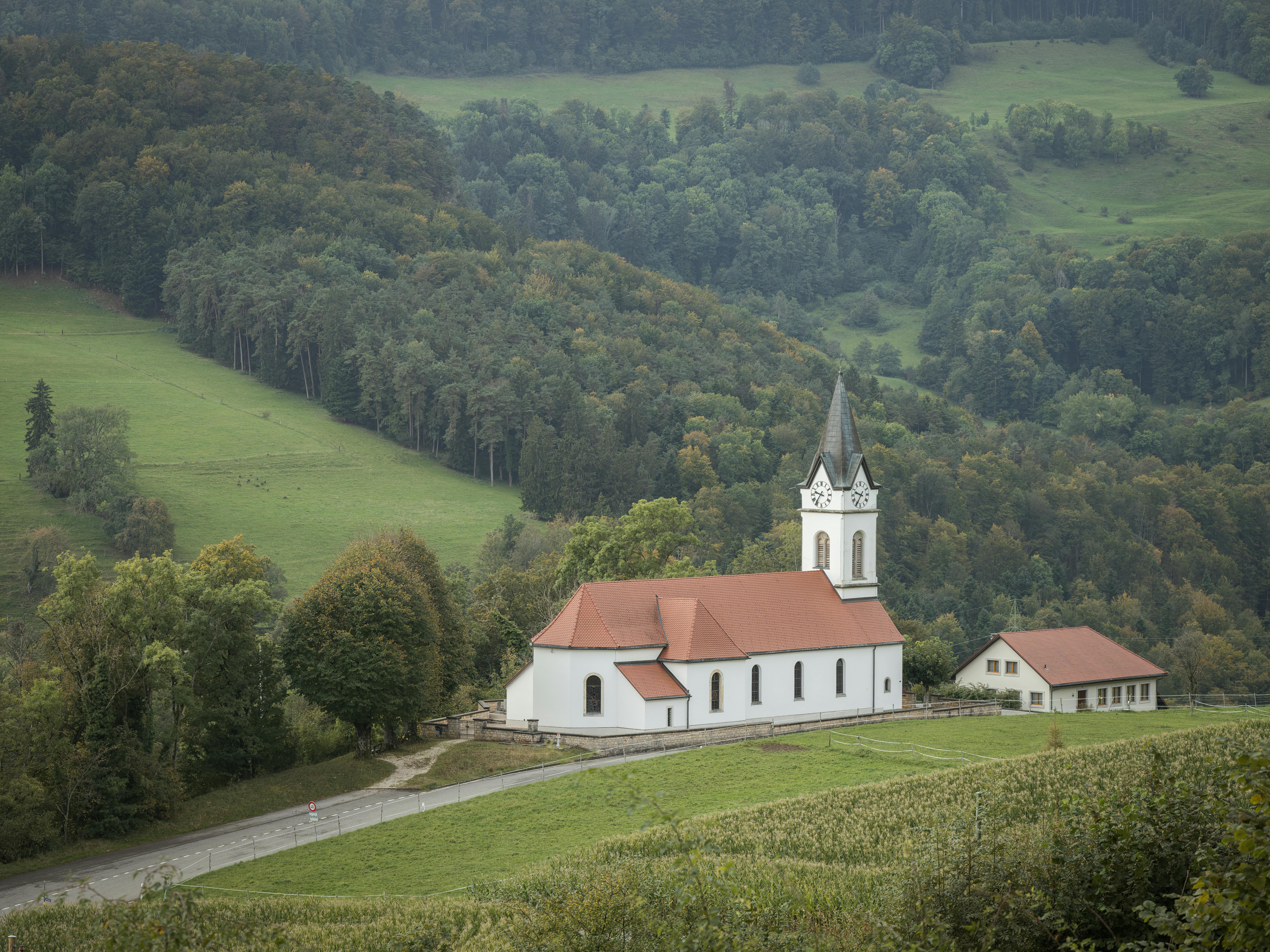 Scenic Church in Lush Valley Landscape · Free Stock Photo