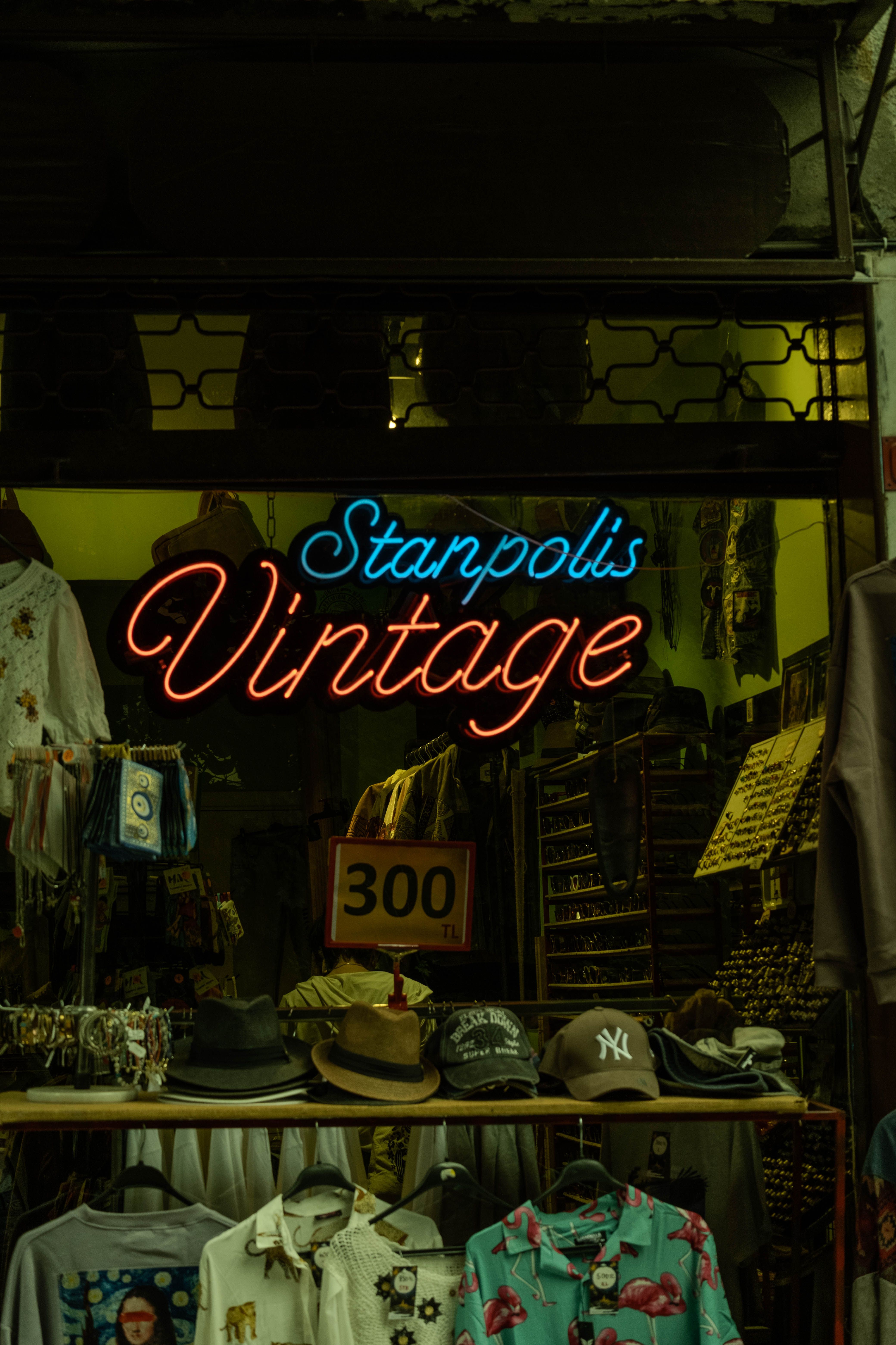 Vintage Clothing Storefront with Neon Sign · Free Stock Photo