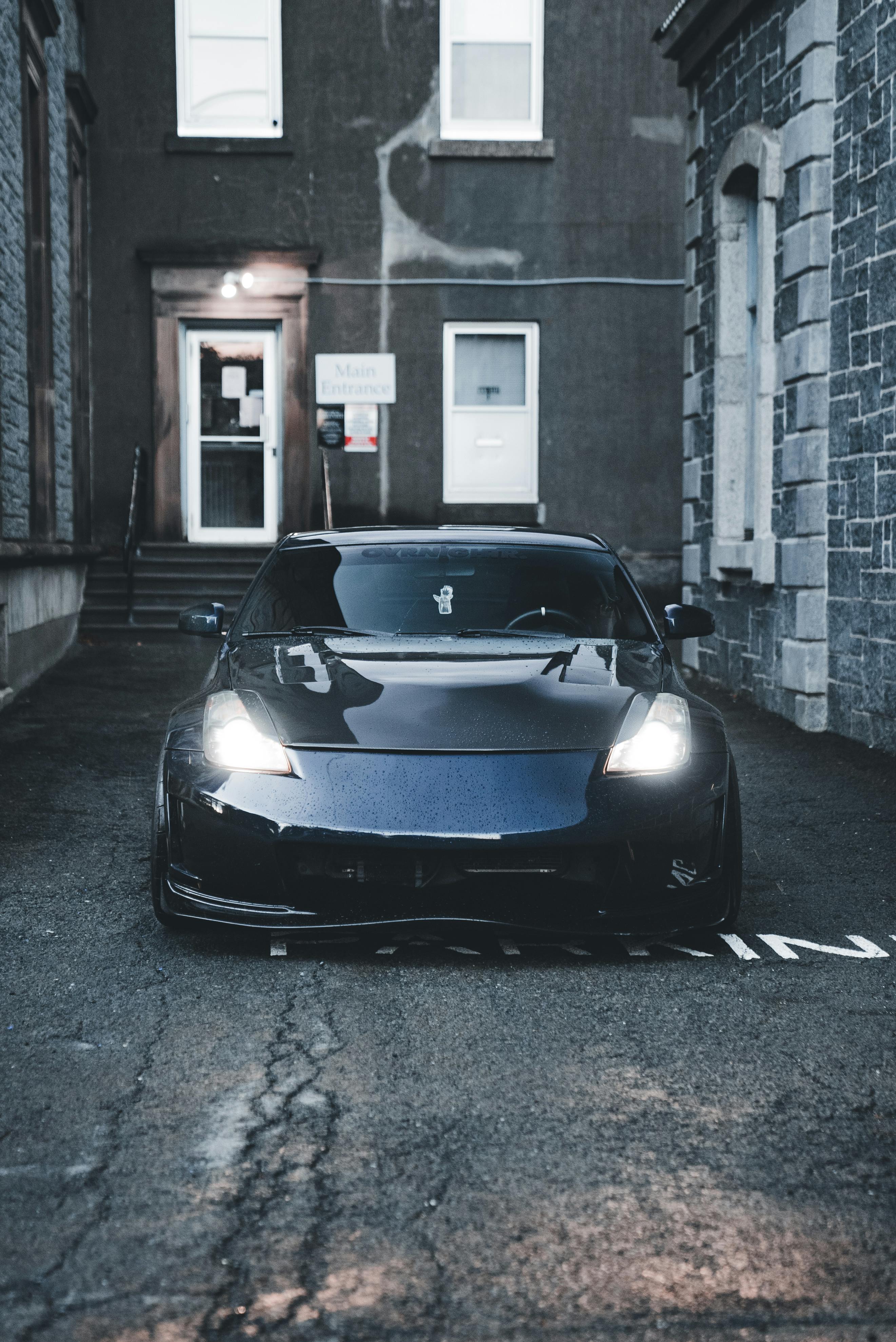 Sleek Modern Car in Urban Alleyway Setting · Free Stock Photo