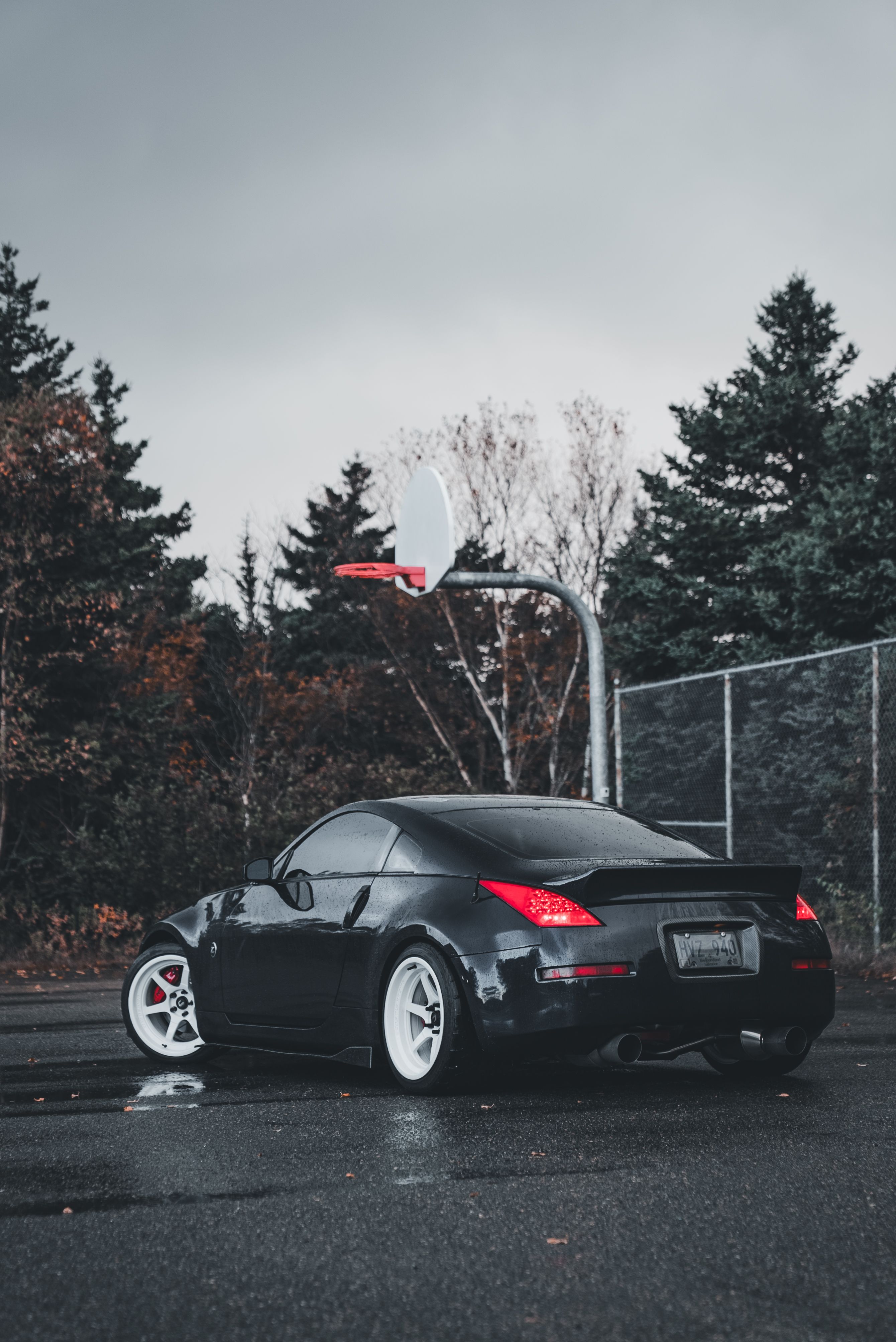 Sleek Sports Car in Urban Basketball Court · Free Stock Photo